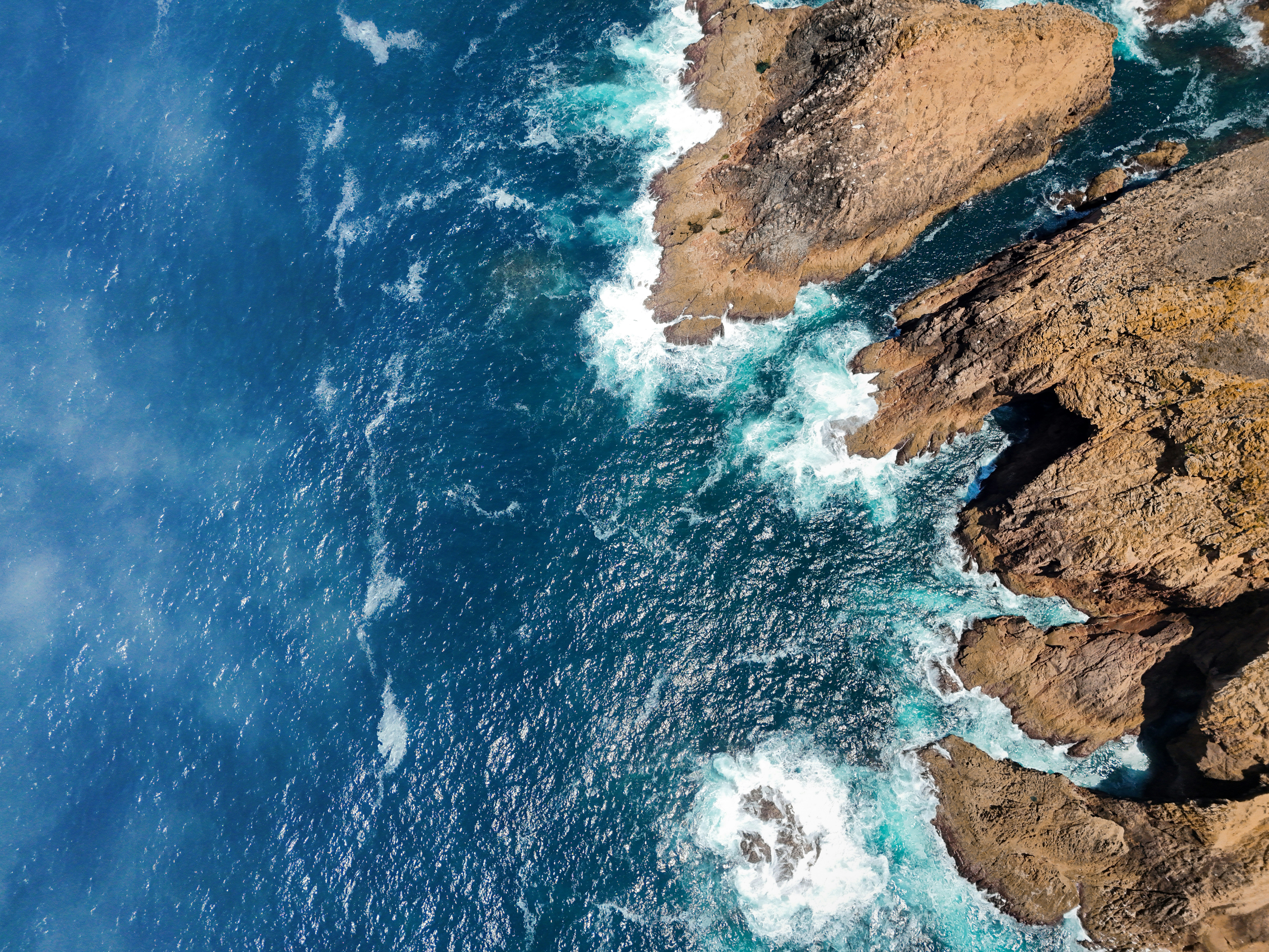 Cliffside Azure: Turquoise Peaks Crashing into the Ocean
