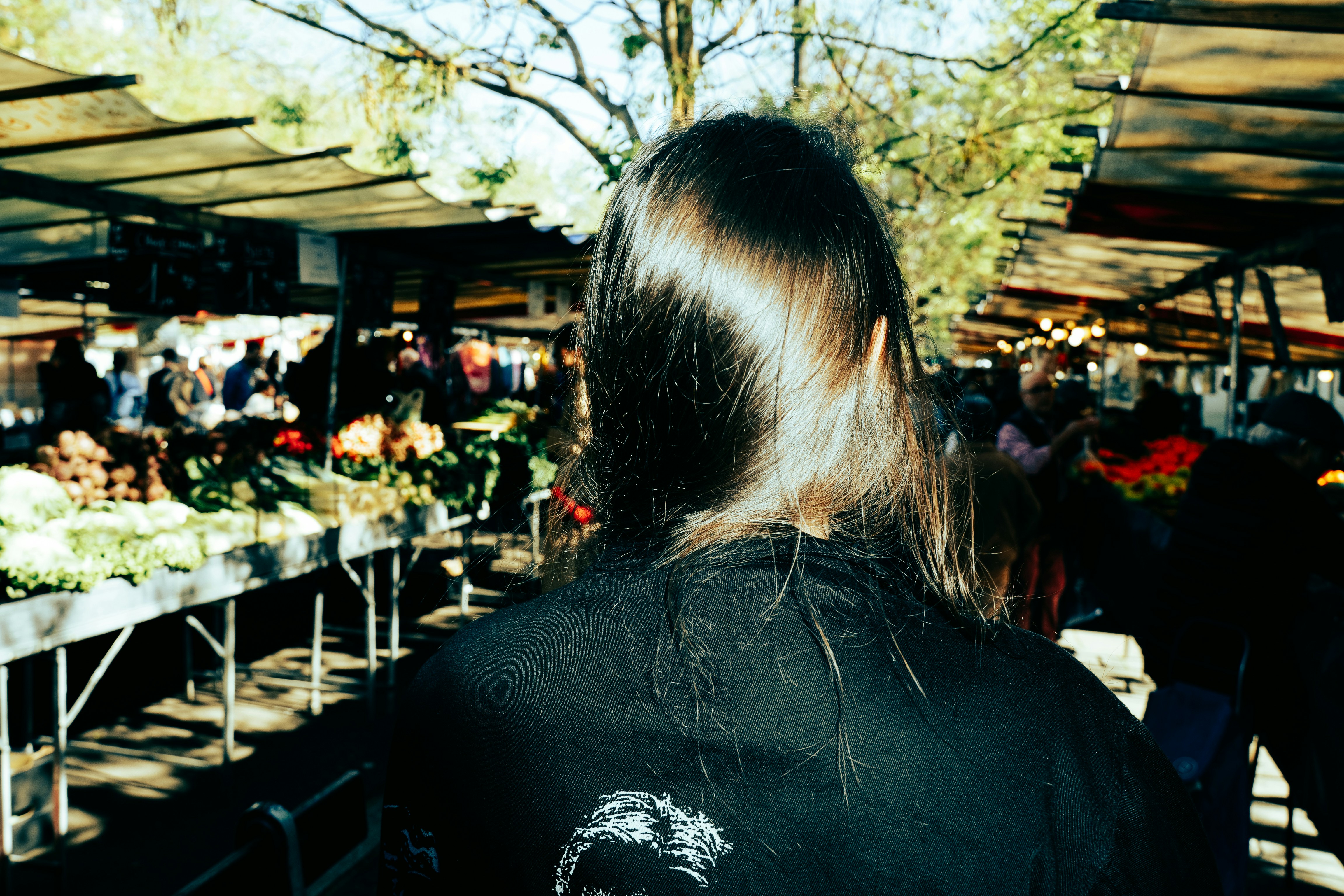 Backlit Vendor Alley: A Market Portrait in Sunlit Color