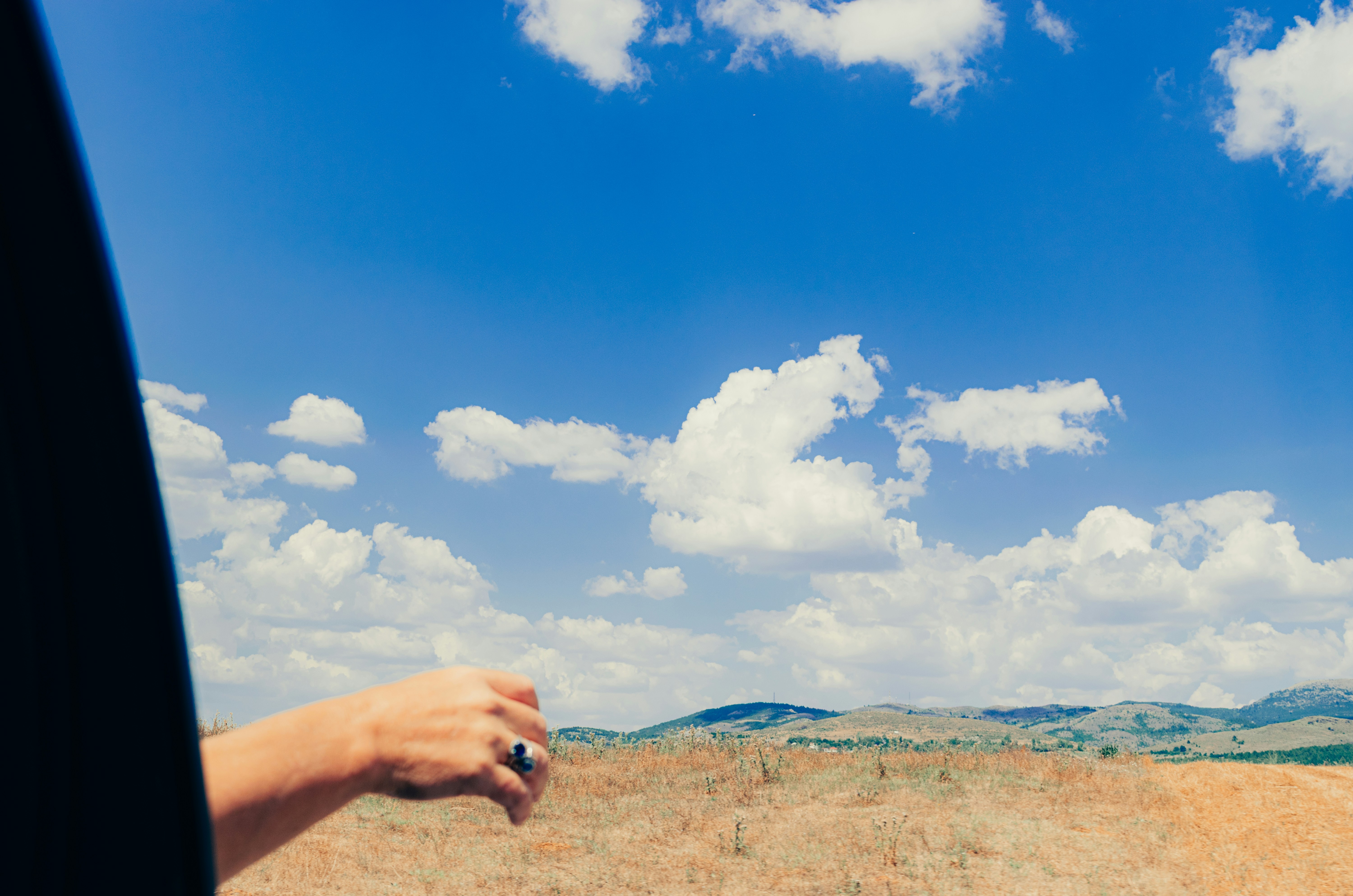 Desert Horizon with Outstretched Hand and Window Frame