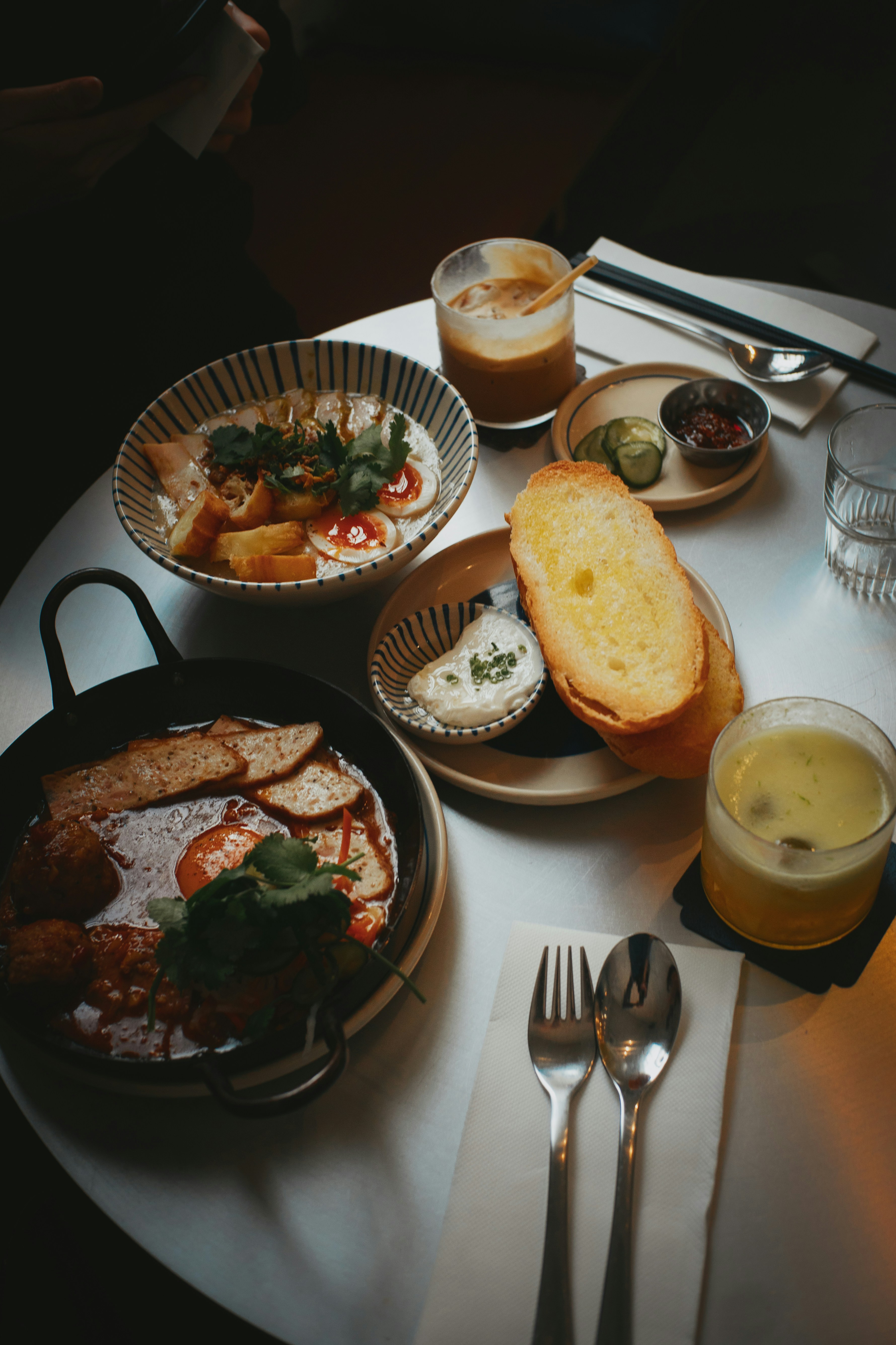 Skewers, Soups, and Toasted Golden Comforts on a White Tablecloth