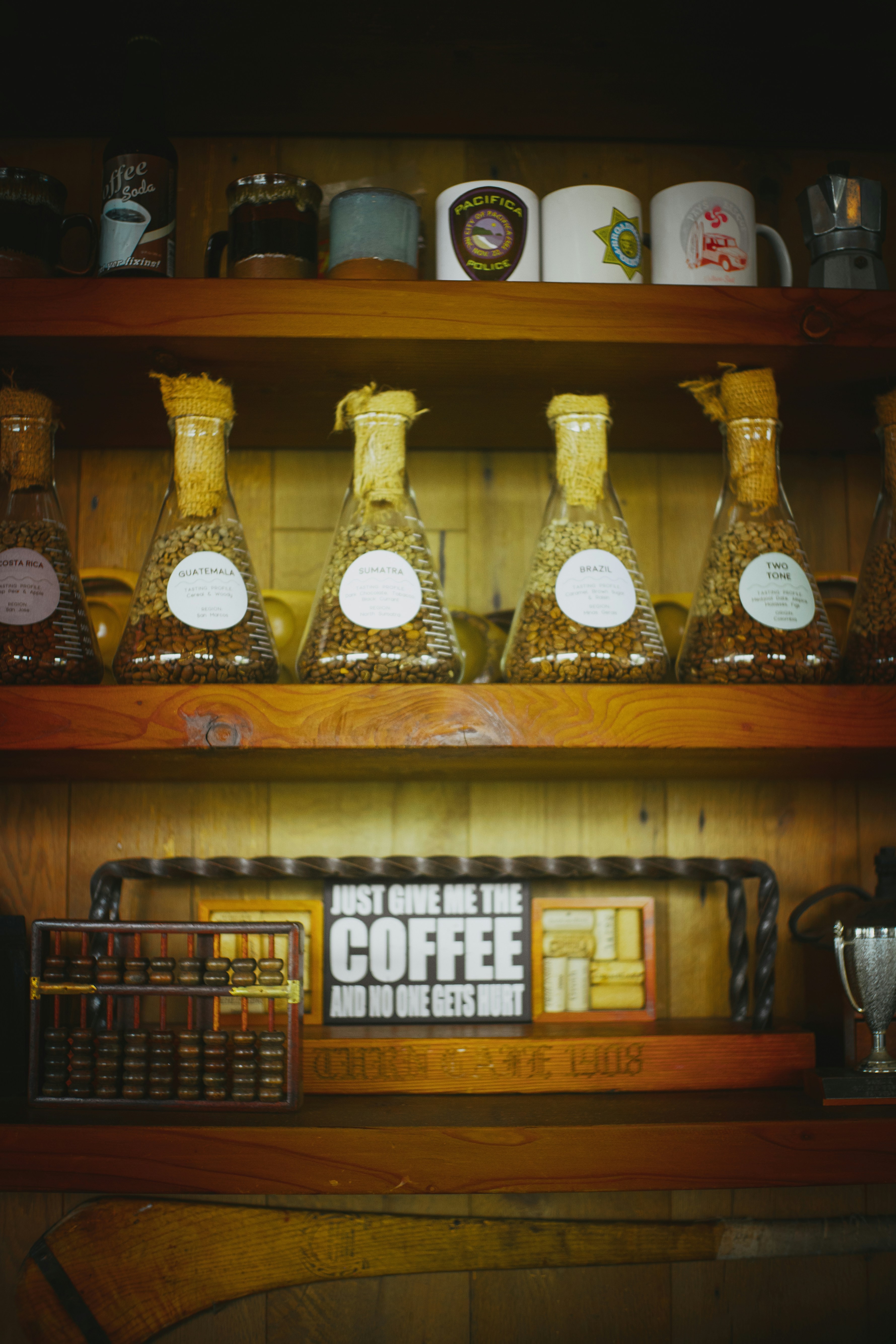 Bar Shelf Constellation: Bottles, Beans, and a Coffee Motto
