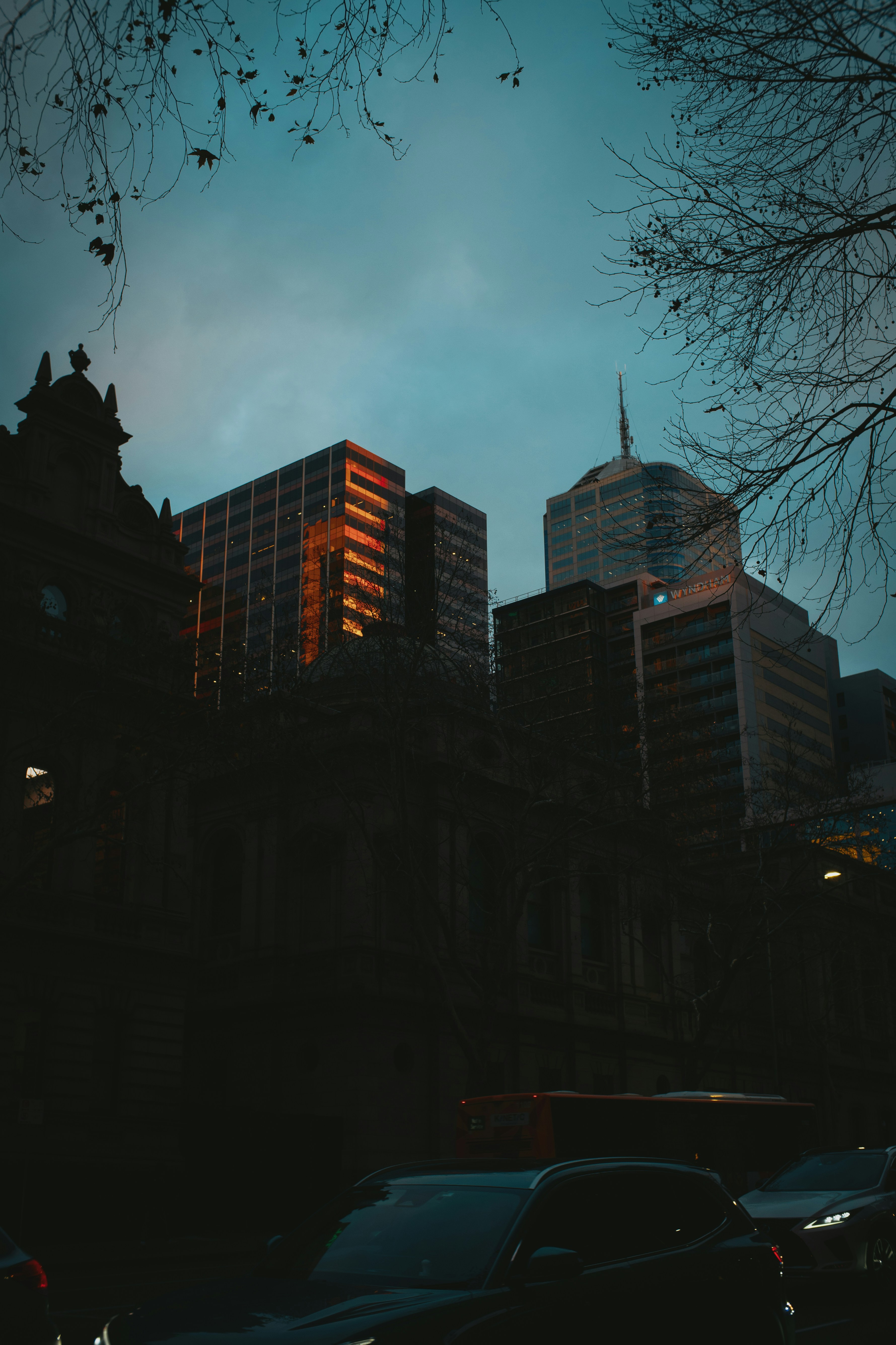 Sunset Glass: City Towers Catch Firelight Over a Quiet Street