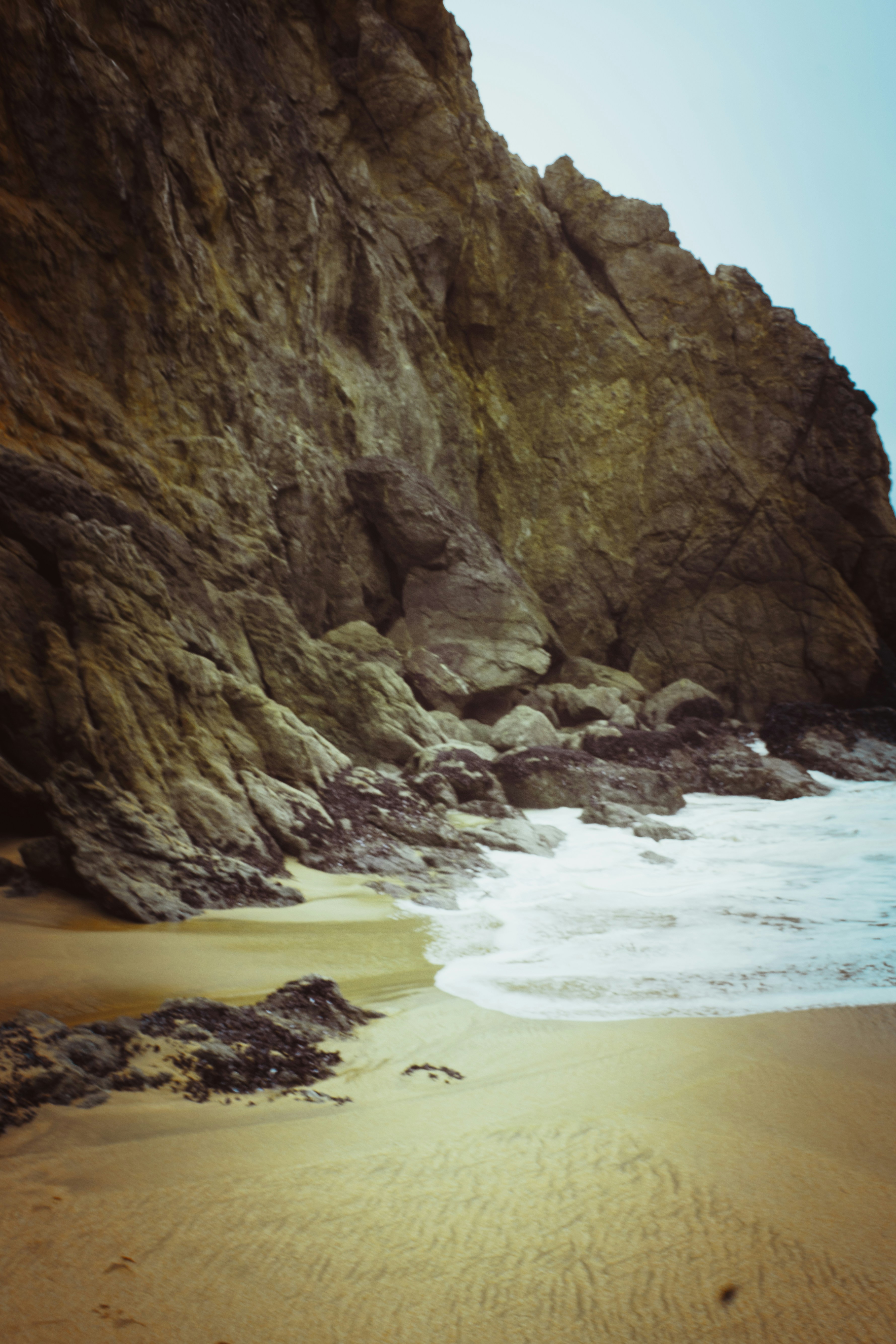 Rugged Cliffs Meeting a Quiet Shore