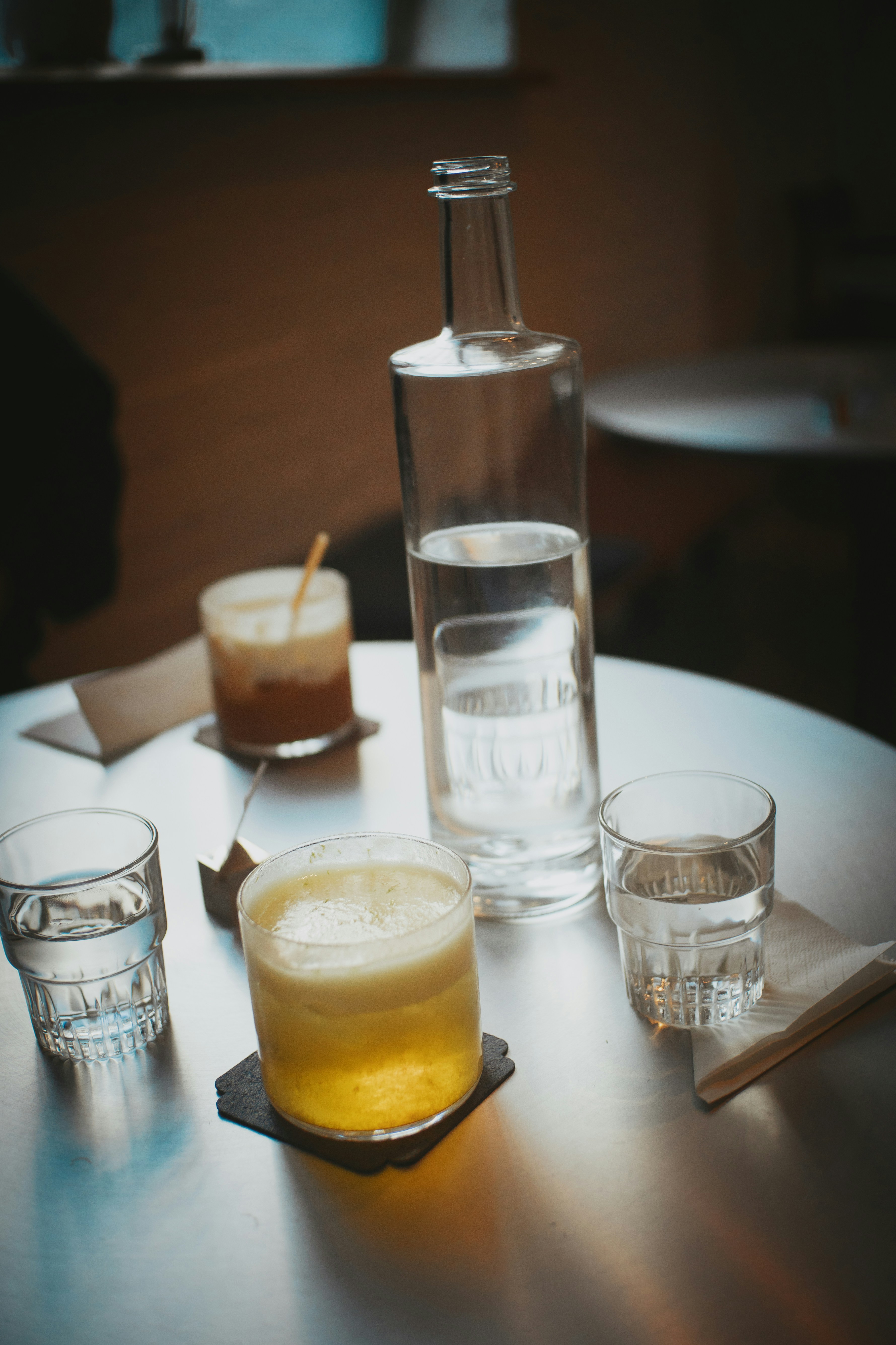Glass Bottles, Amber Beverages, and Soft Evening Light