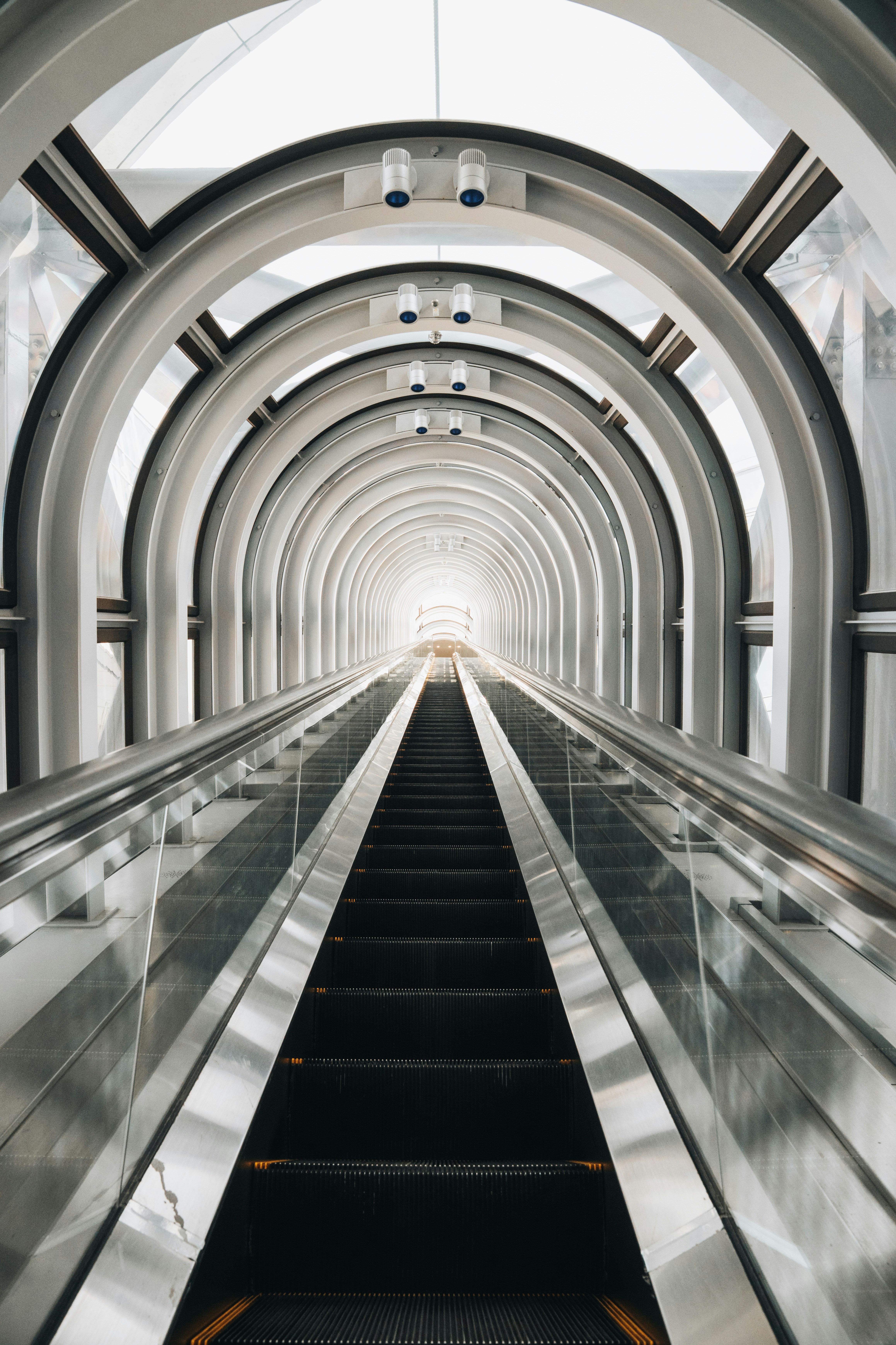 Symphonic Arc: An Endless escalator through a glass-archway