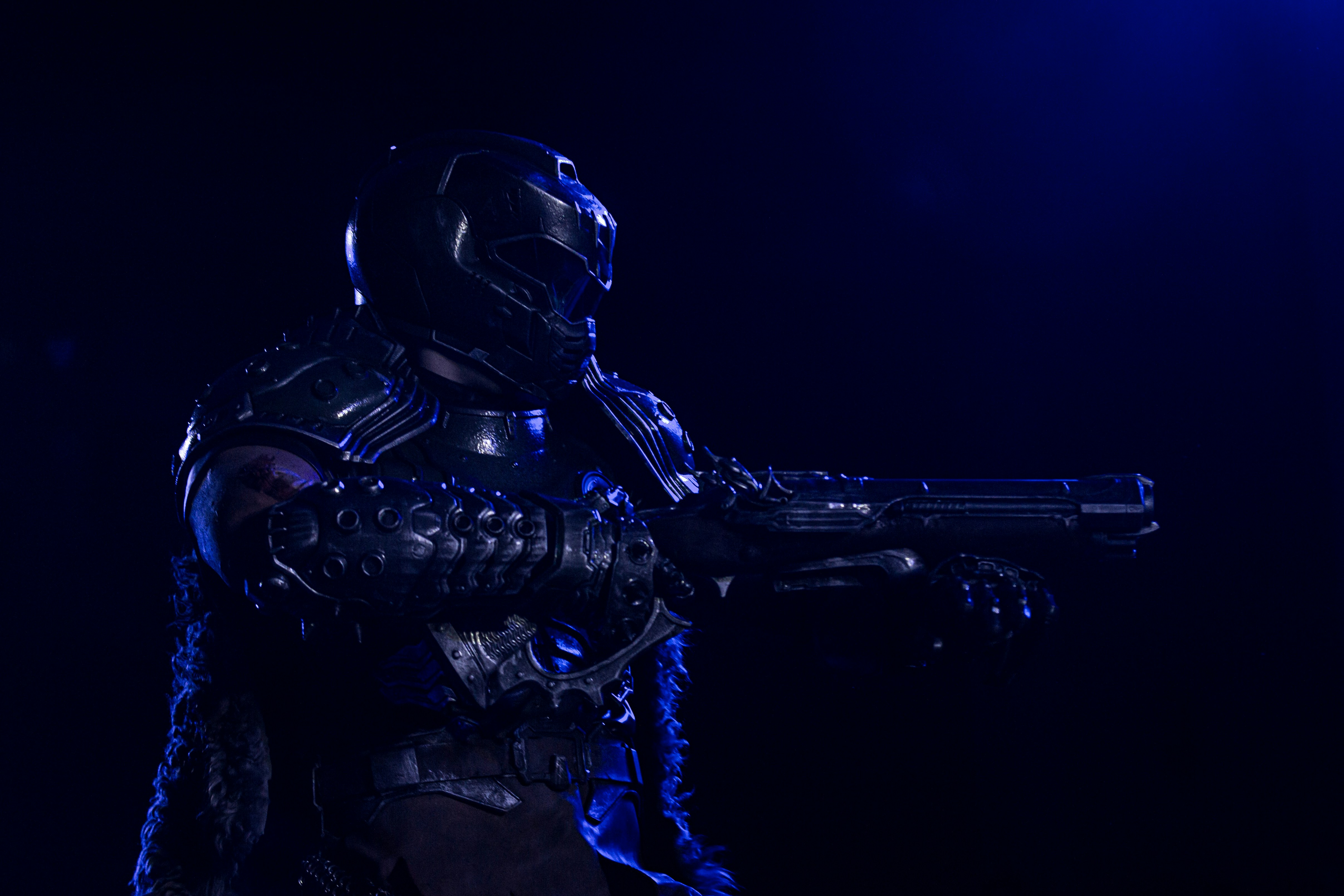Armored Sentinel in a Blue-lit Stage