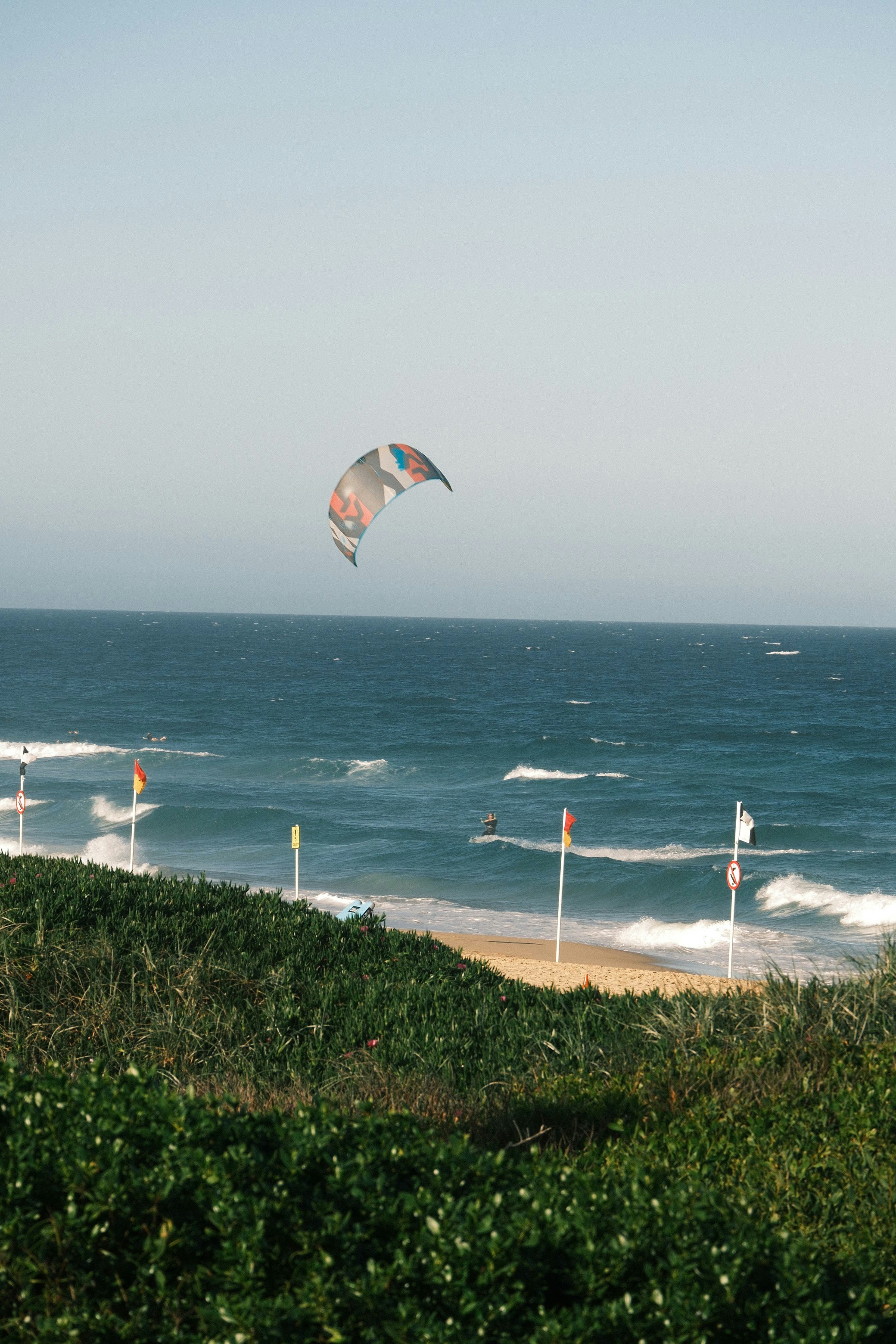 Kite Surfer Against a Pale Ocean Skyline