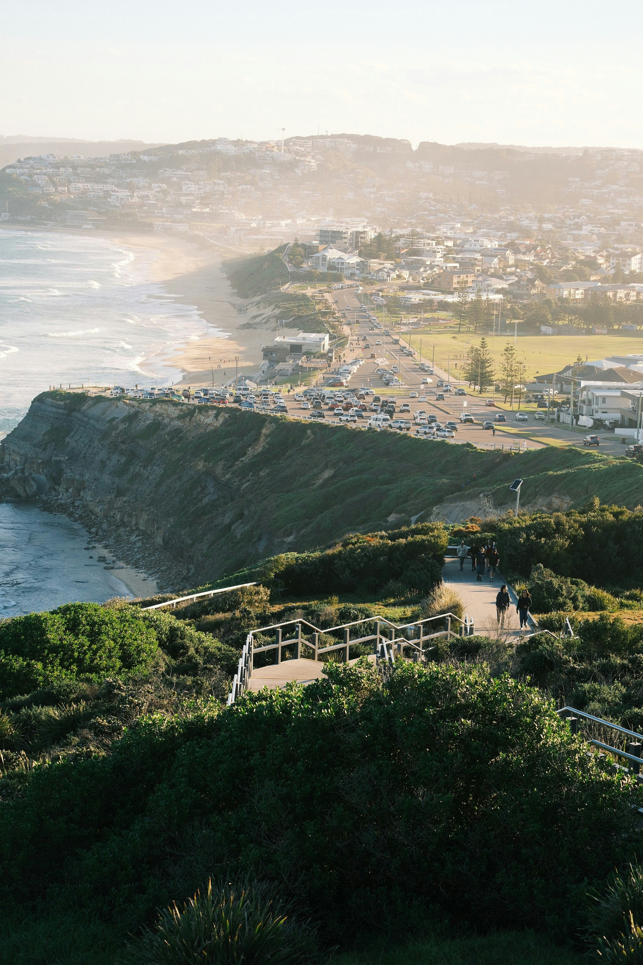 Clifftop Path Overlooking a Pacific Coastline Town