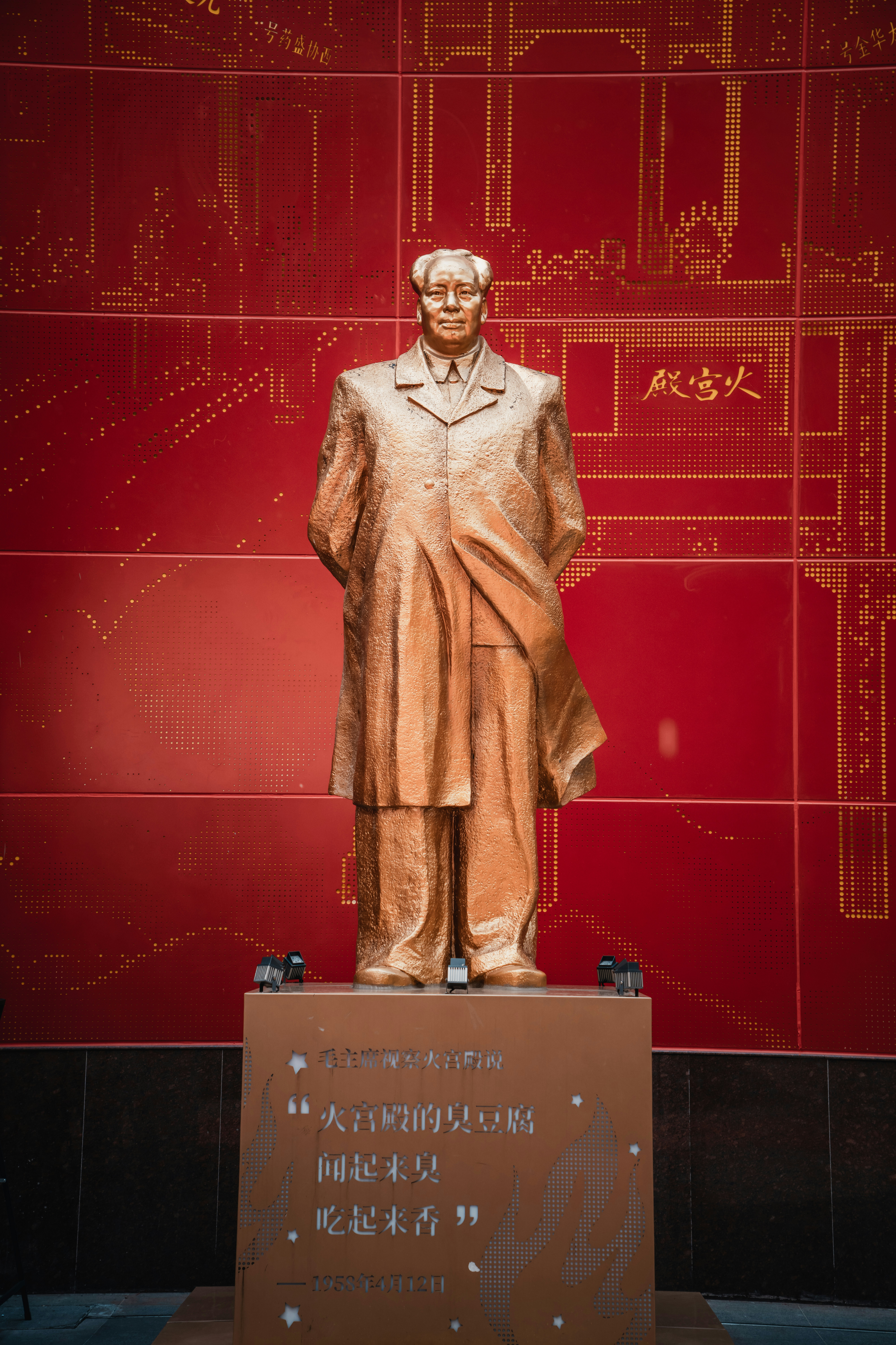 Bronze Statue in a Red Gallery: A Portrait of Public Memory