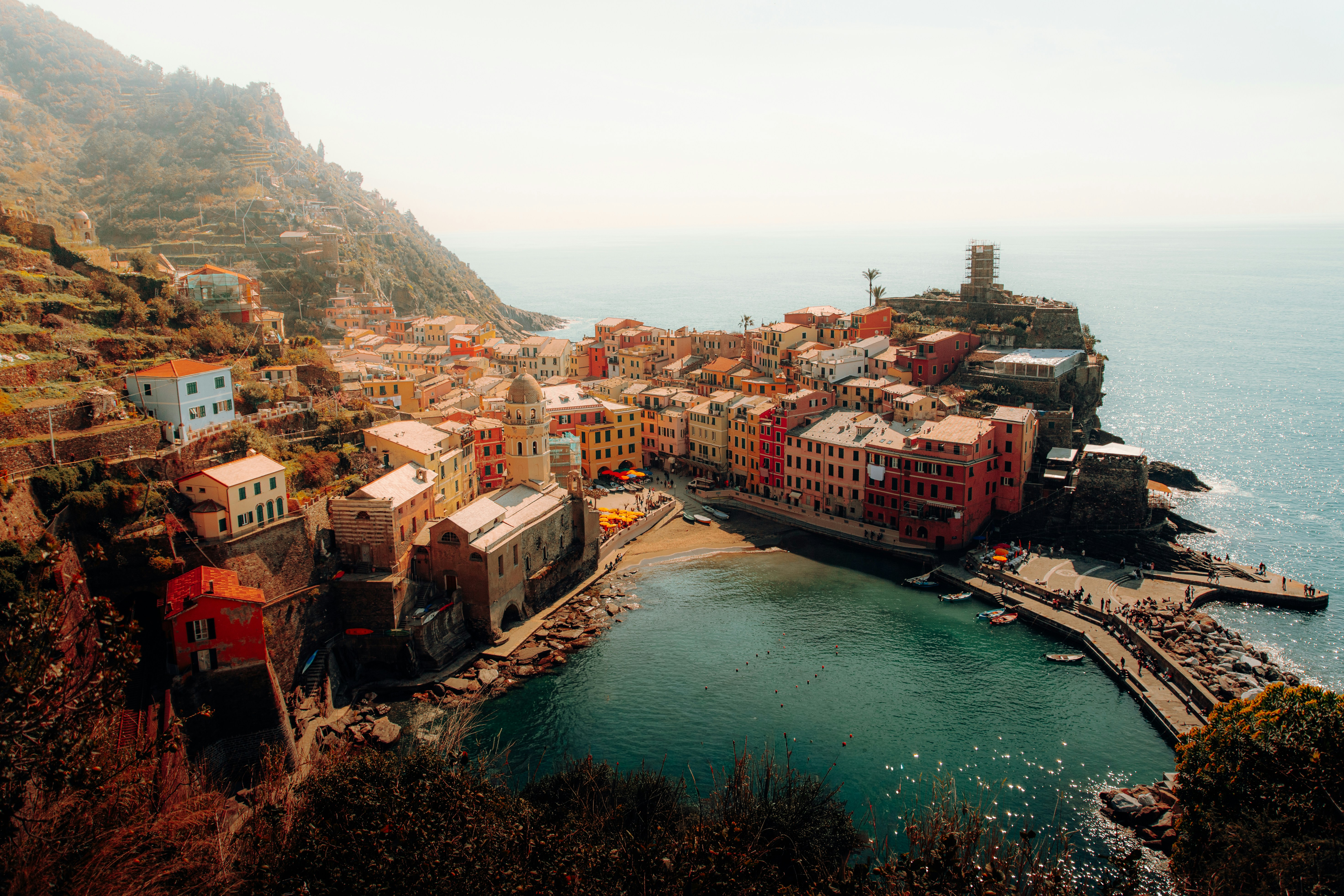 Sunlit Harbor Village Clinging to the Cliff
