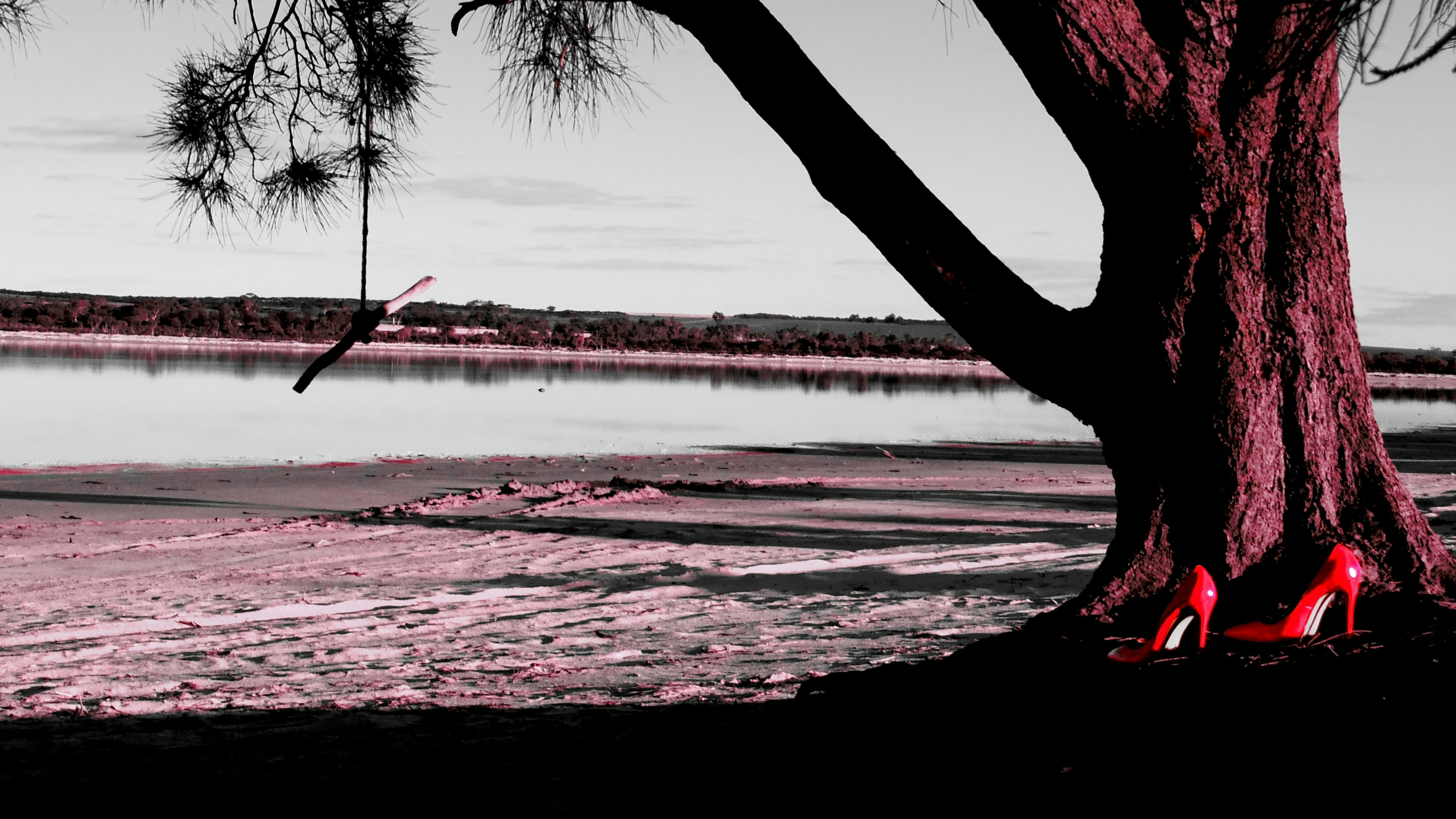 Red Heels by the Shore: A Sunset Standoff