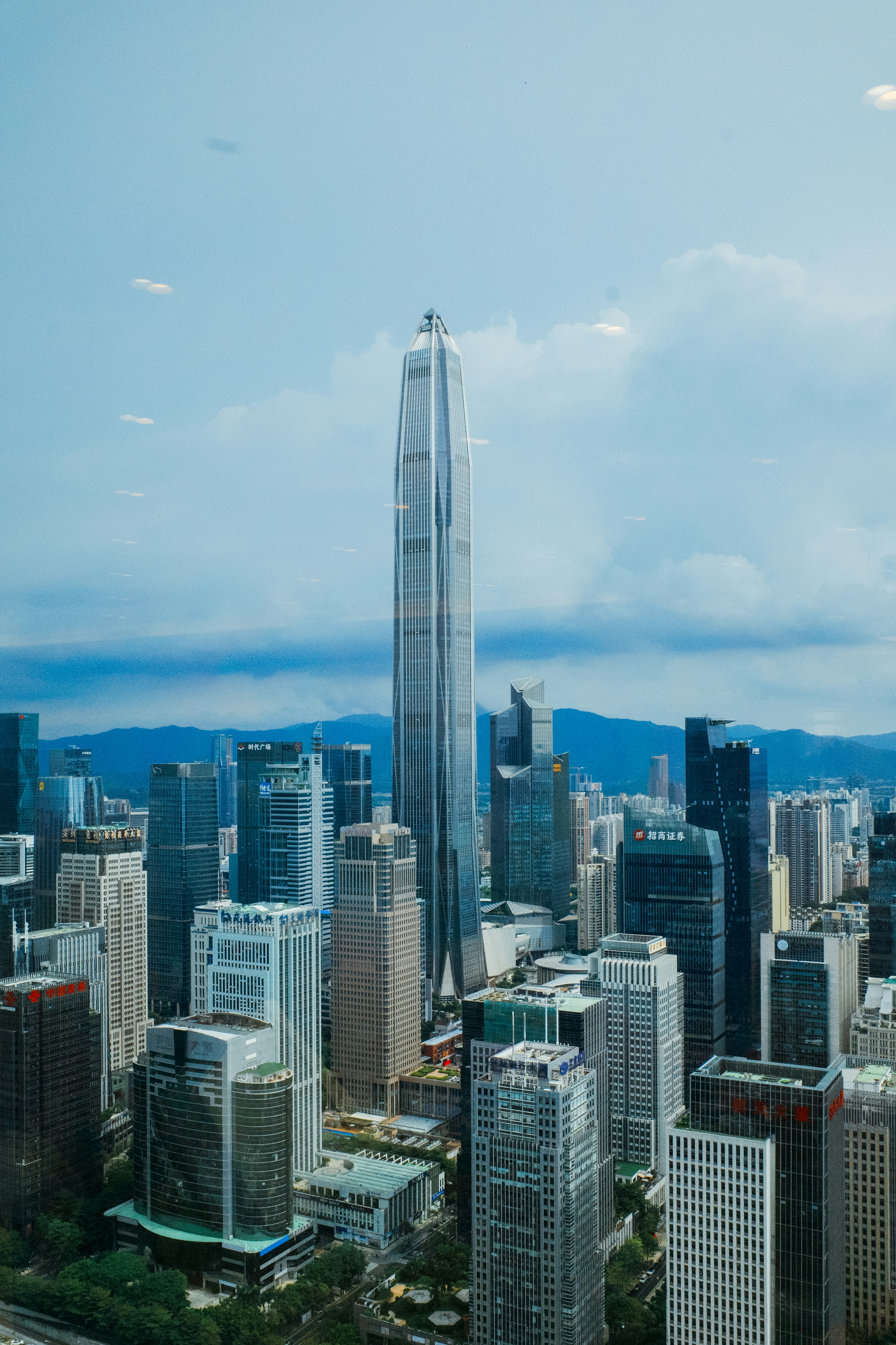 Vertical Giant: A Tower Reigns Over a Sea of Glass and Steel