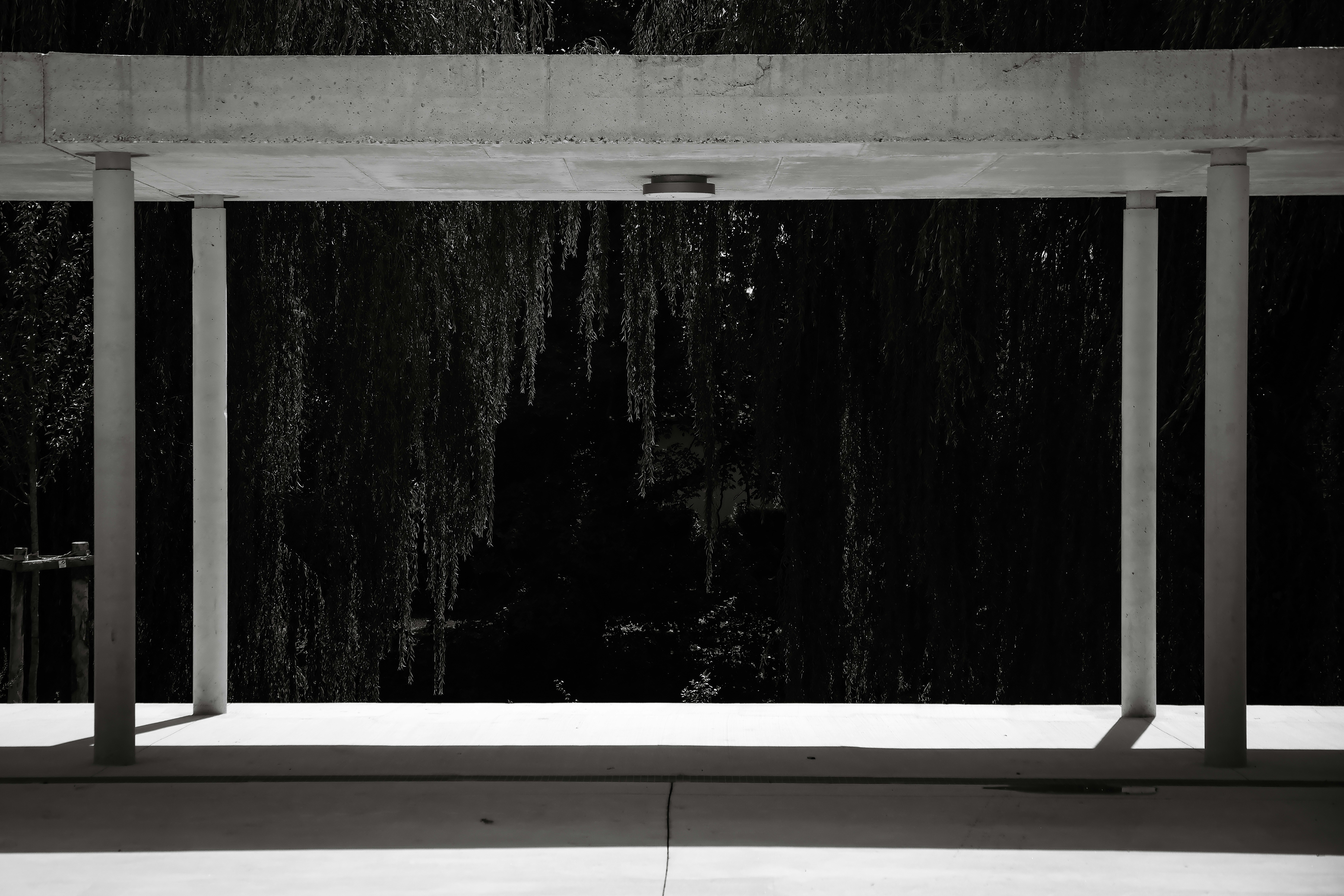 Minimal Corridor: Lighted Plinths Framing a Field of Shadow