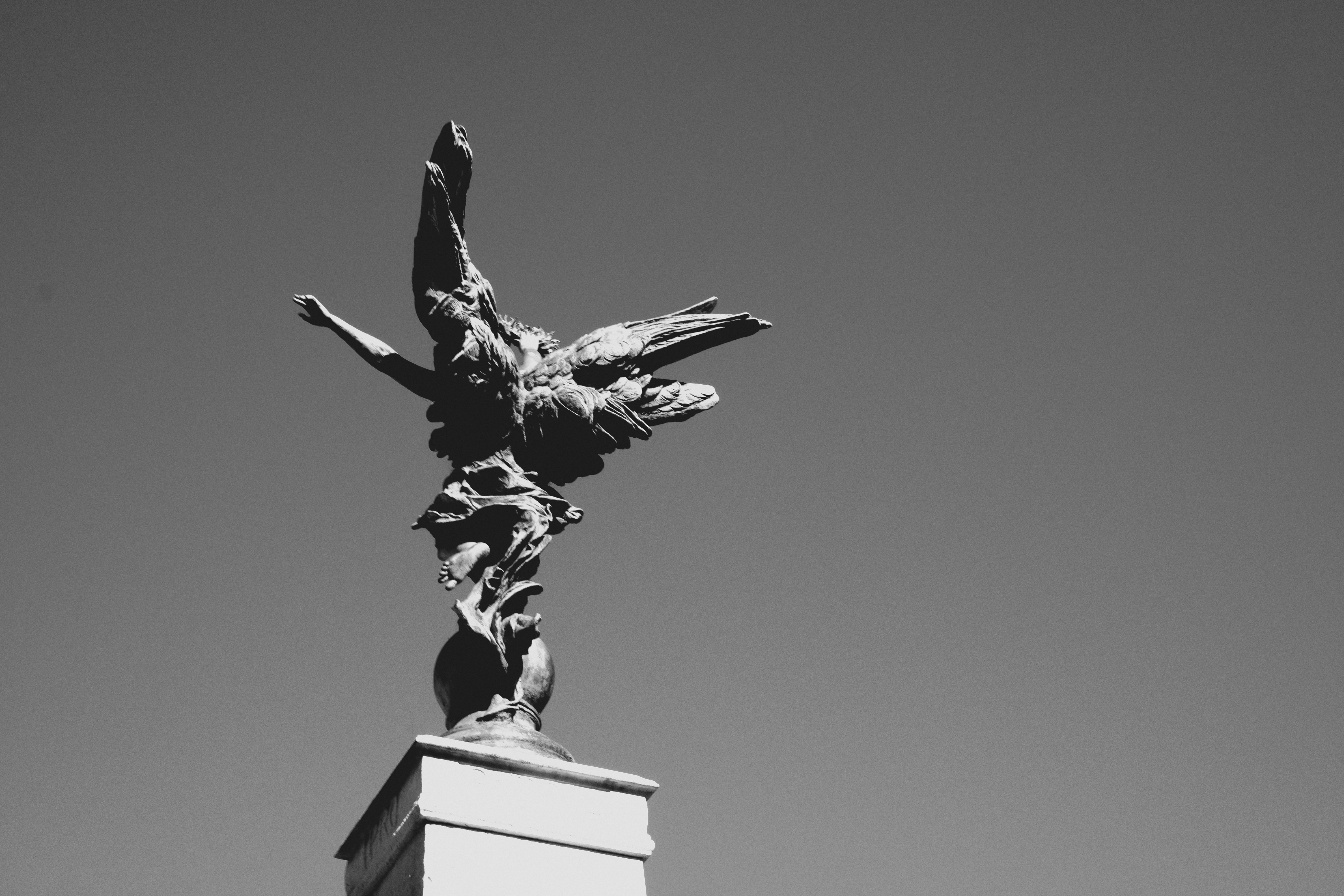 Winged Statue Ascending Above a Pedestal