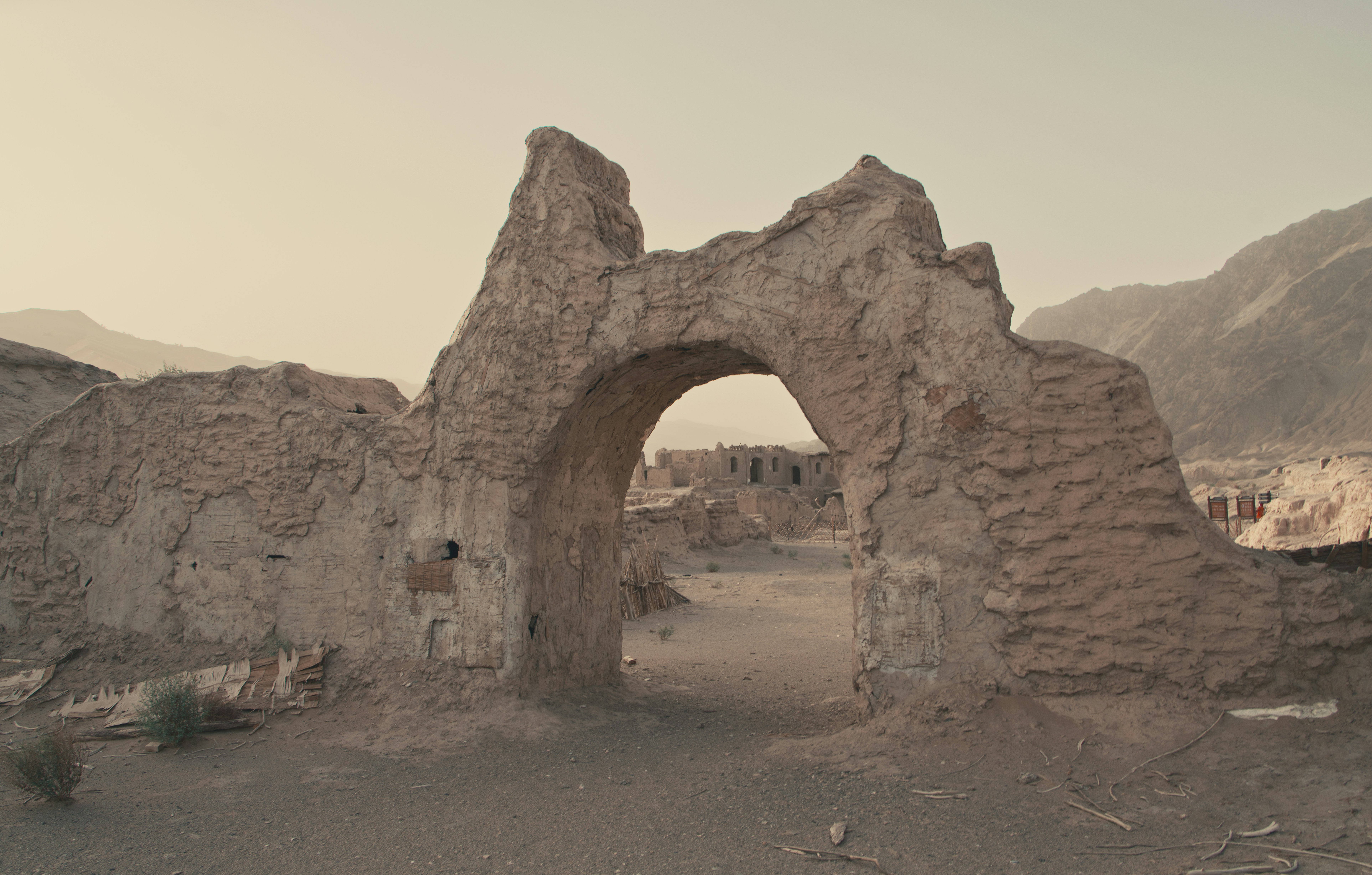 Desert Arch of Time: Weathered Ruins Framing an Open Gate