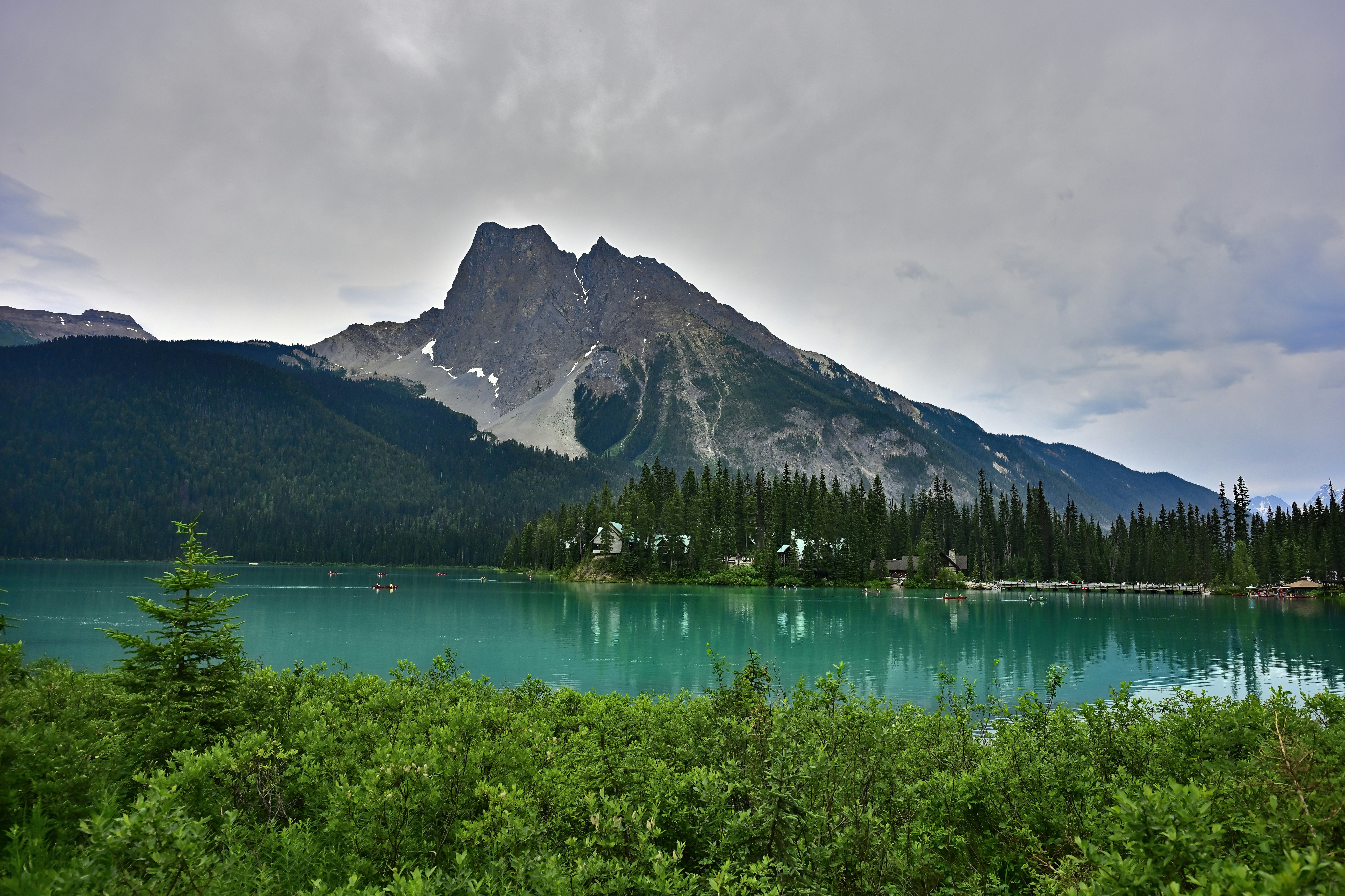 Emerald Lake and Peaks under a Misty Sky