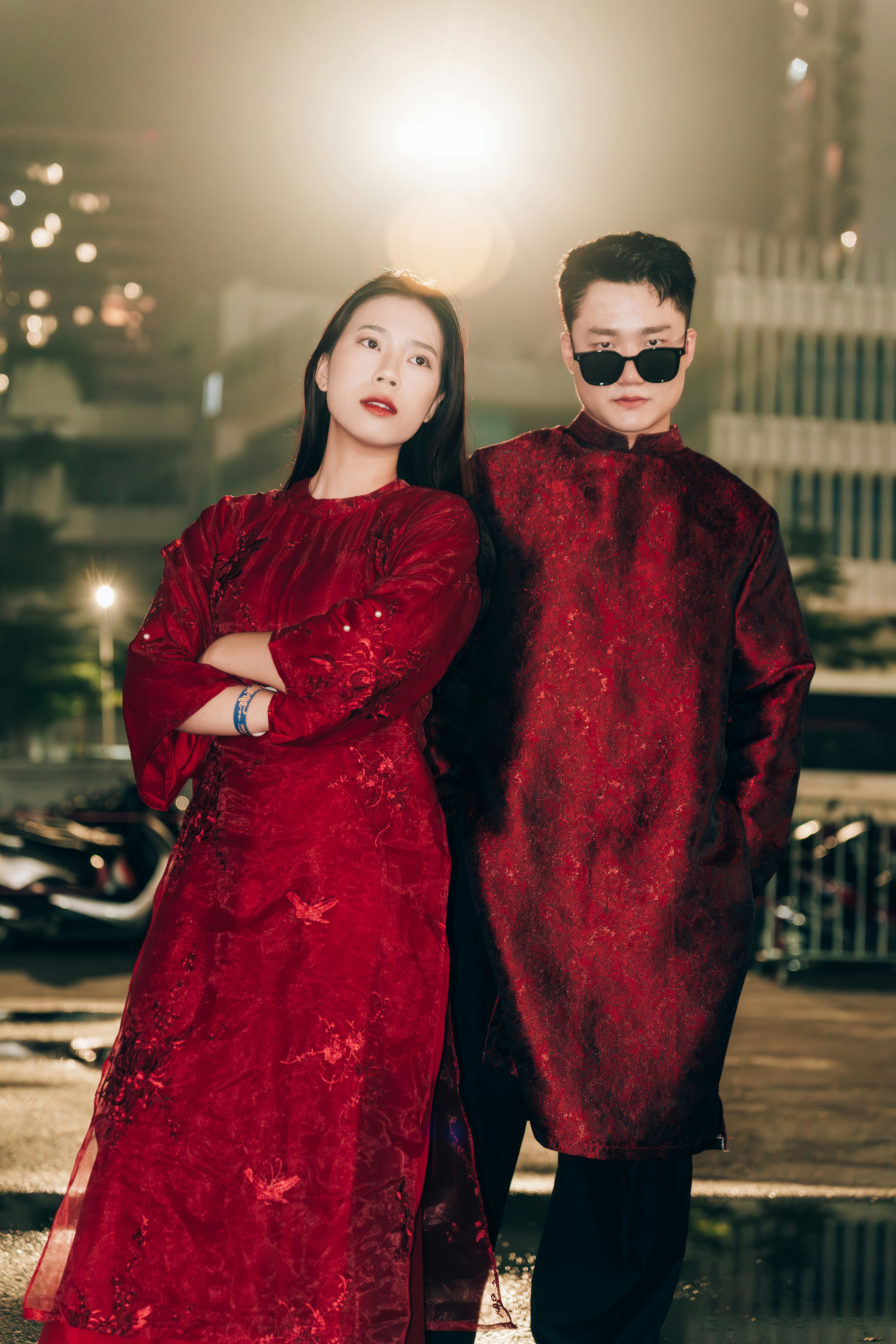 Crimson Silhouettes: Red Attire in Neon Night