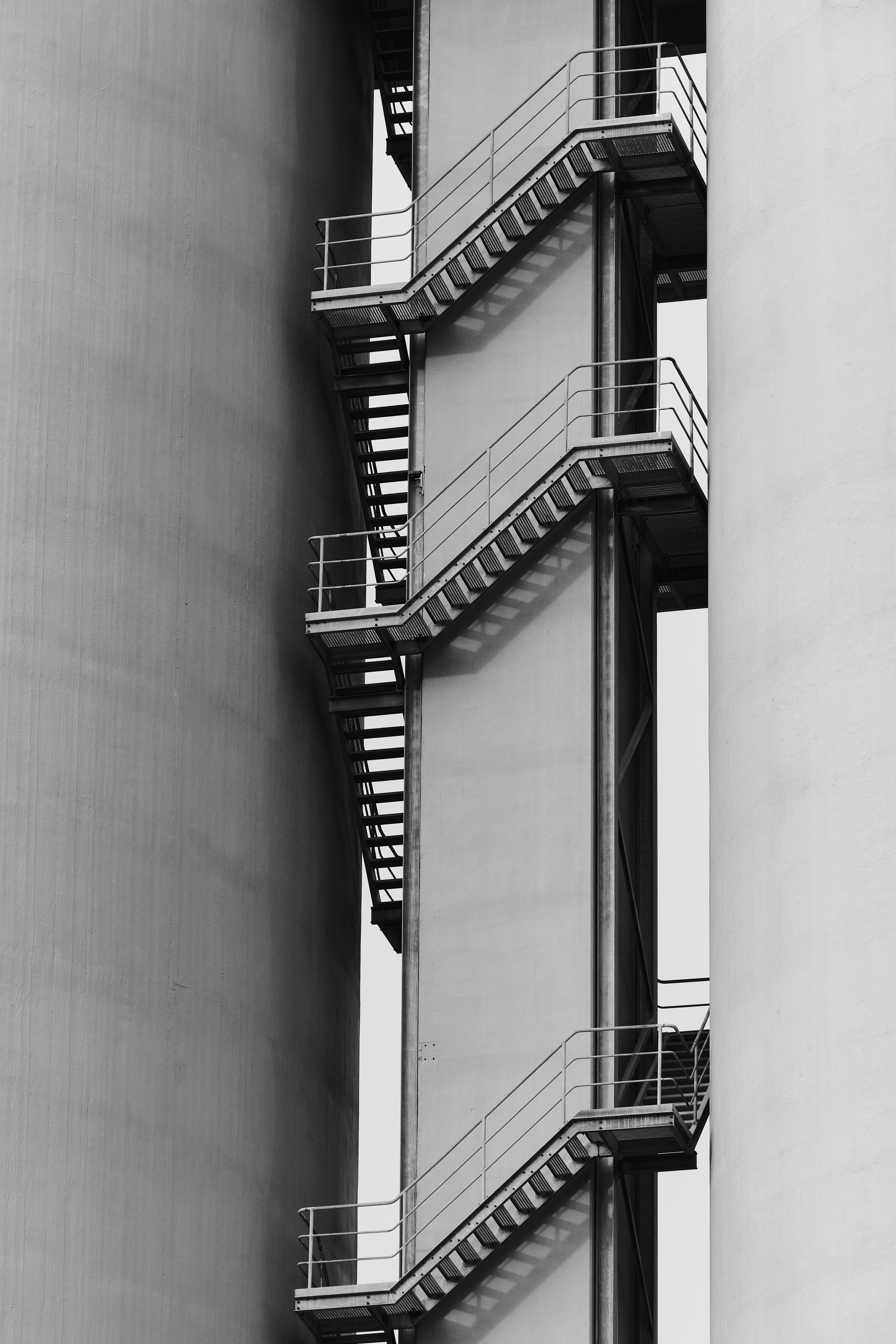 Industrial Staircase Symphony: Vertical Lines and Shadows