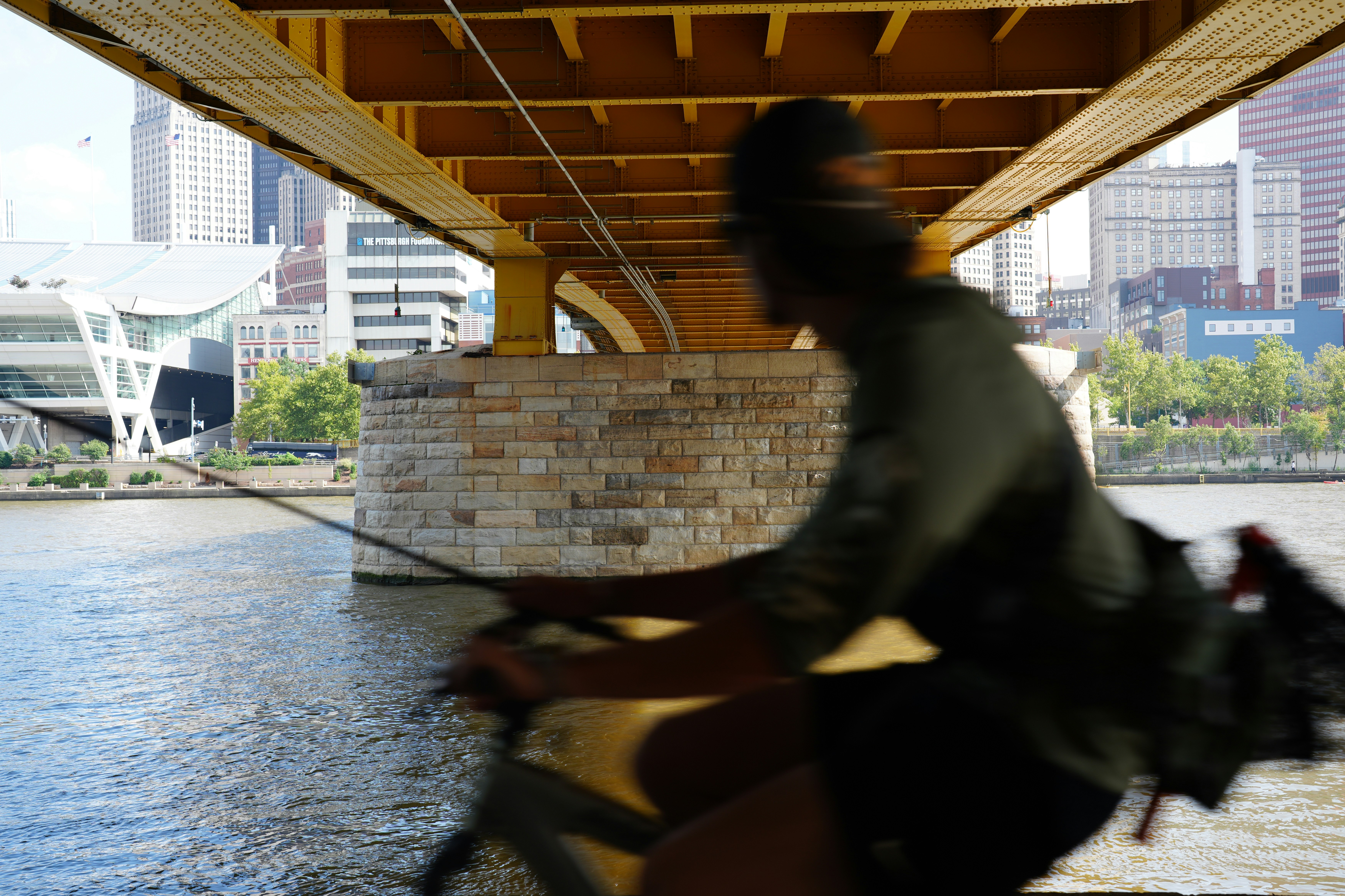 Blurry Rider by the River: Under the Golden Bridge