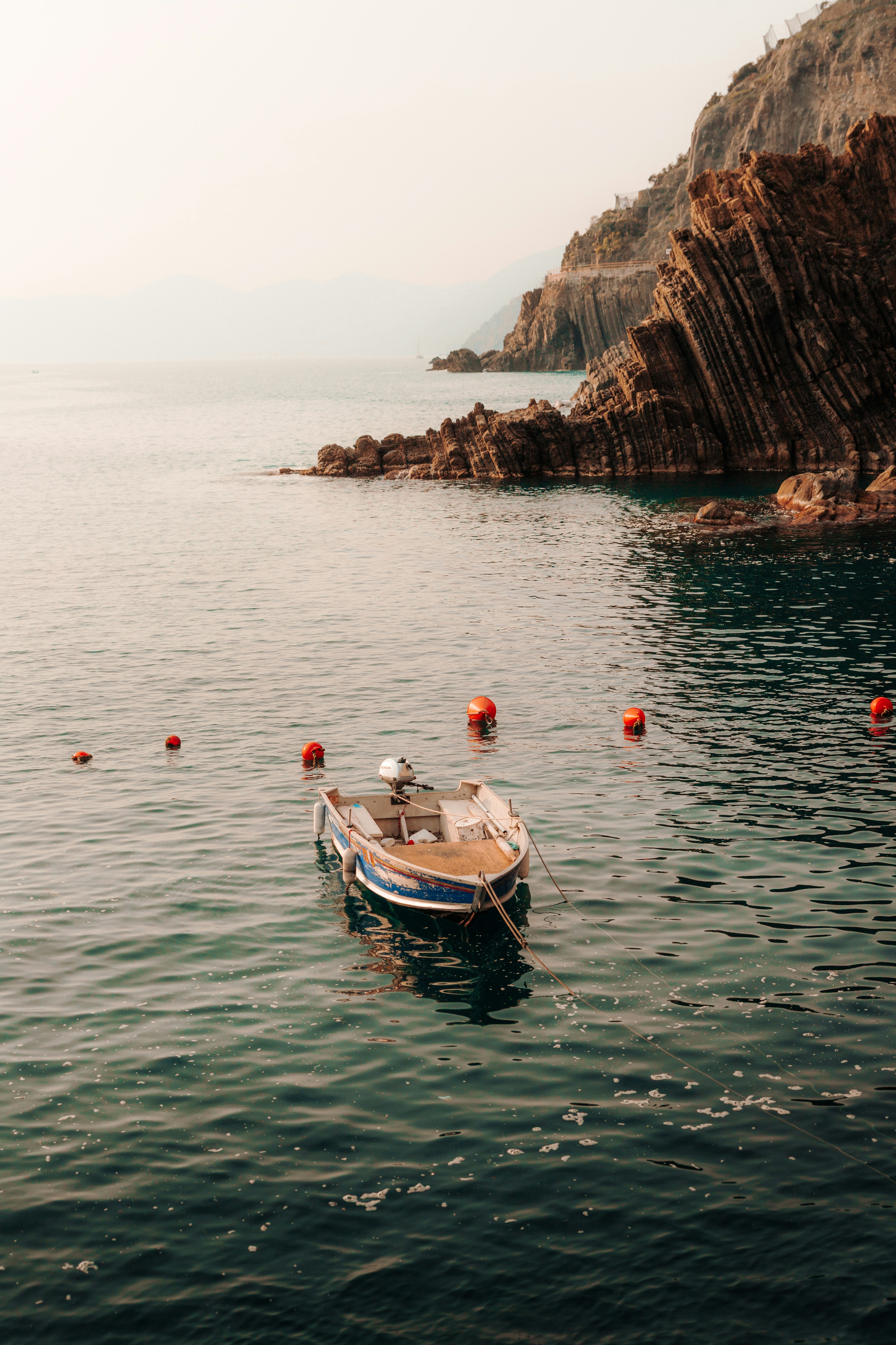 Boat at Rest Against Crimson Cliffs