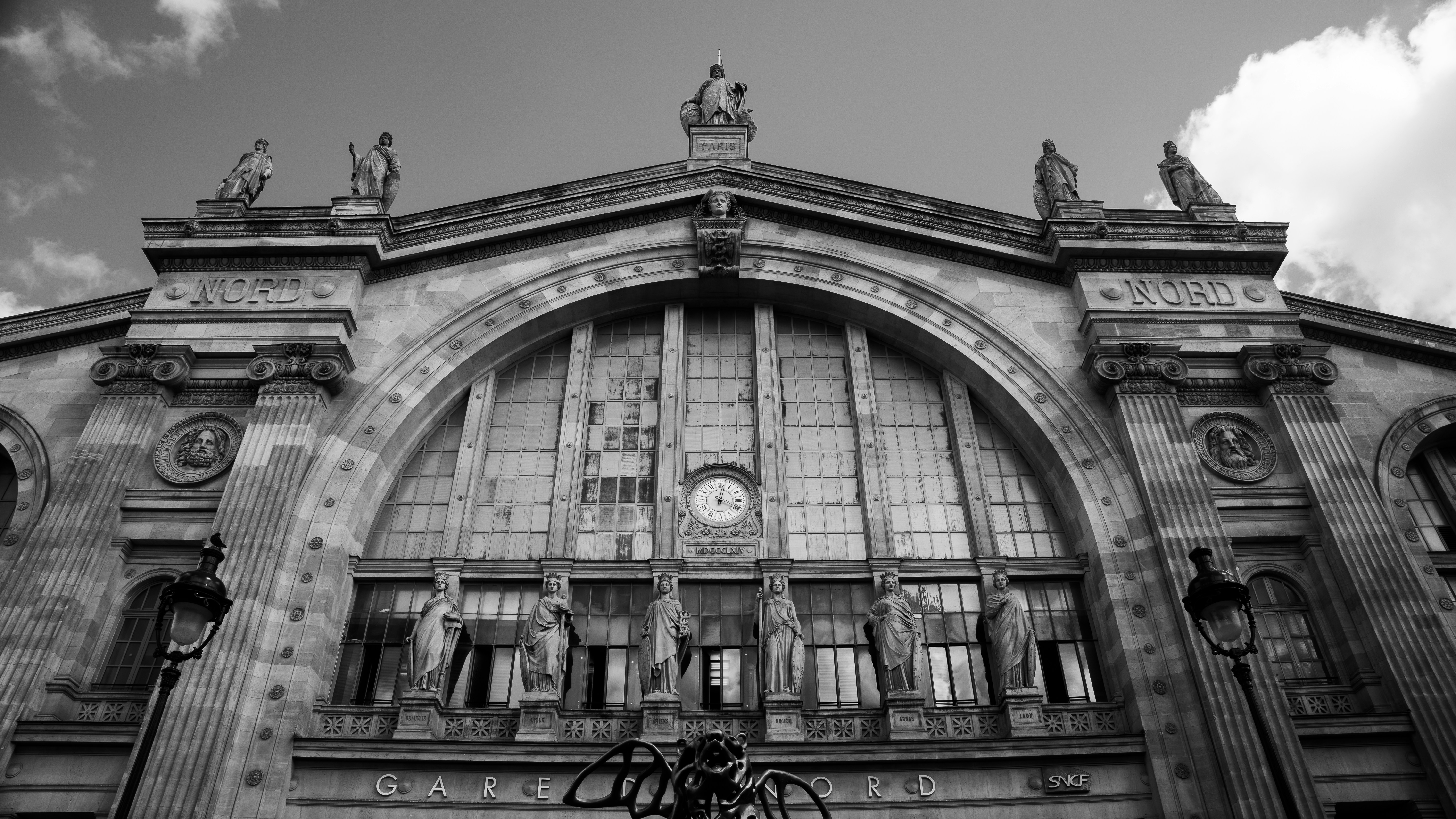 Timeless Arch: A Monumental Train Station Façade in Monochrome