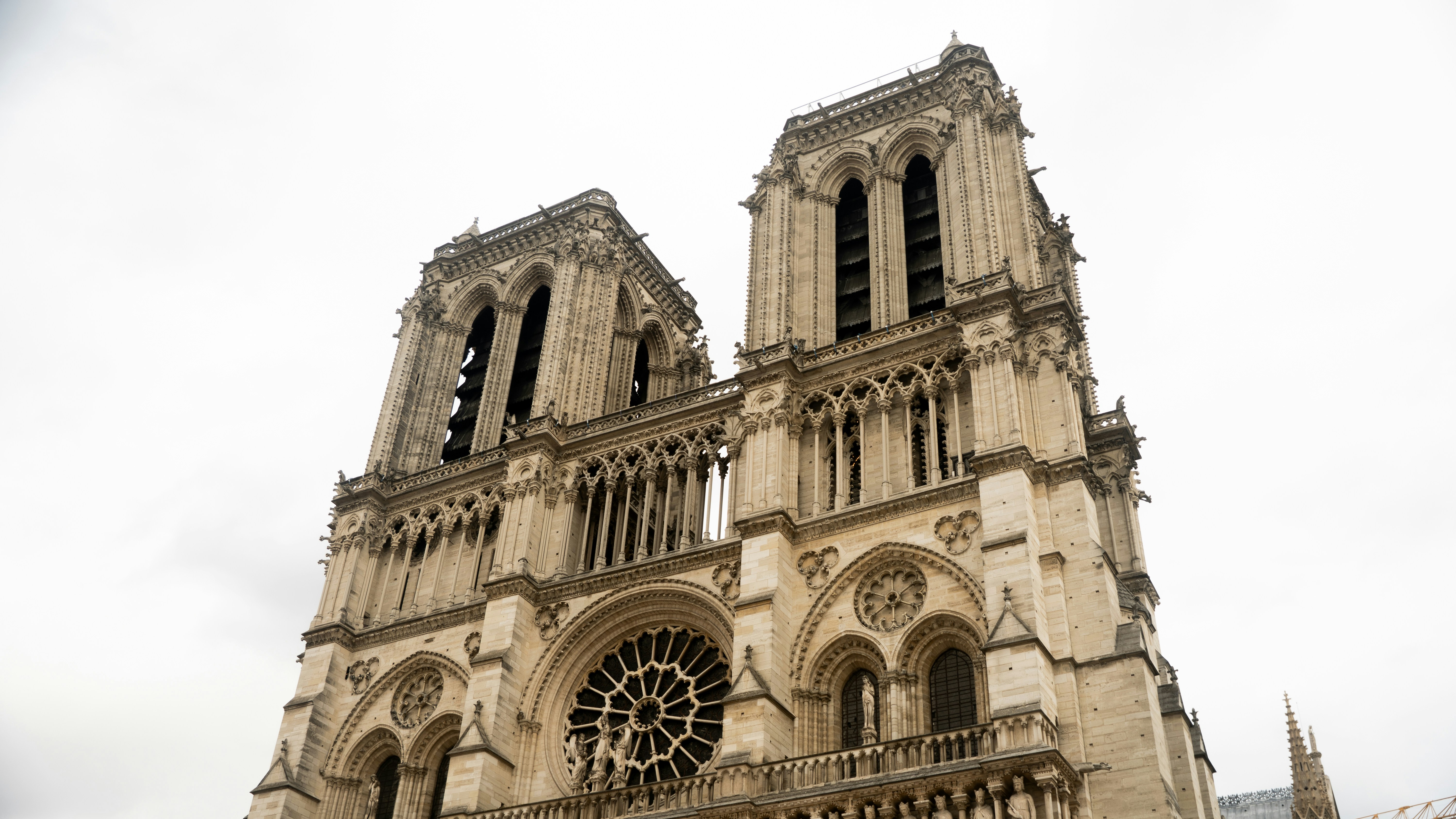 Twin Bell Towers Rising: A Gothic Facade in Stone