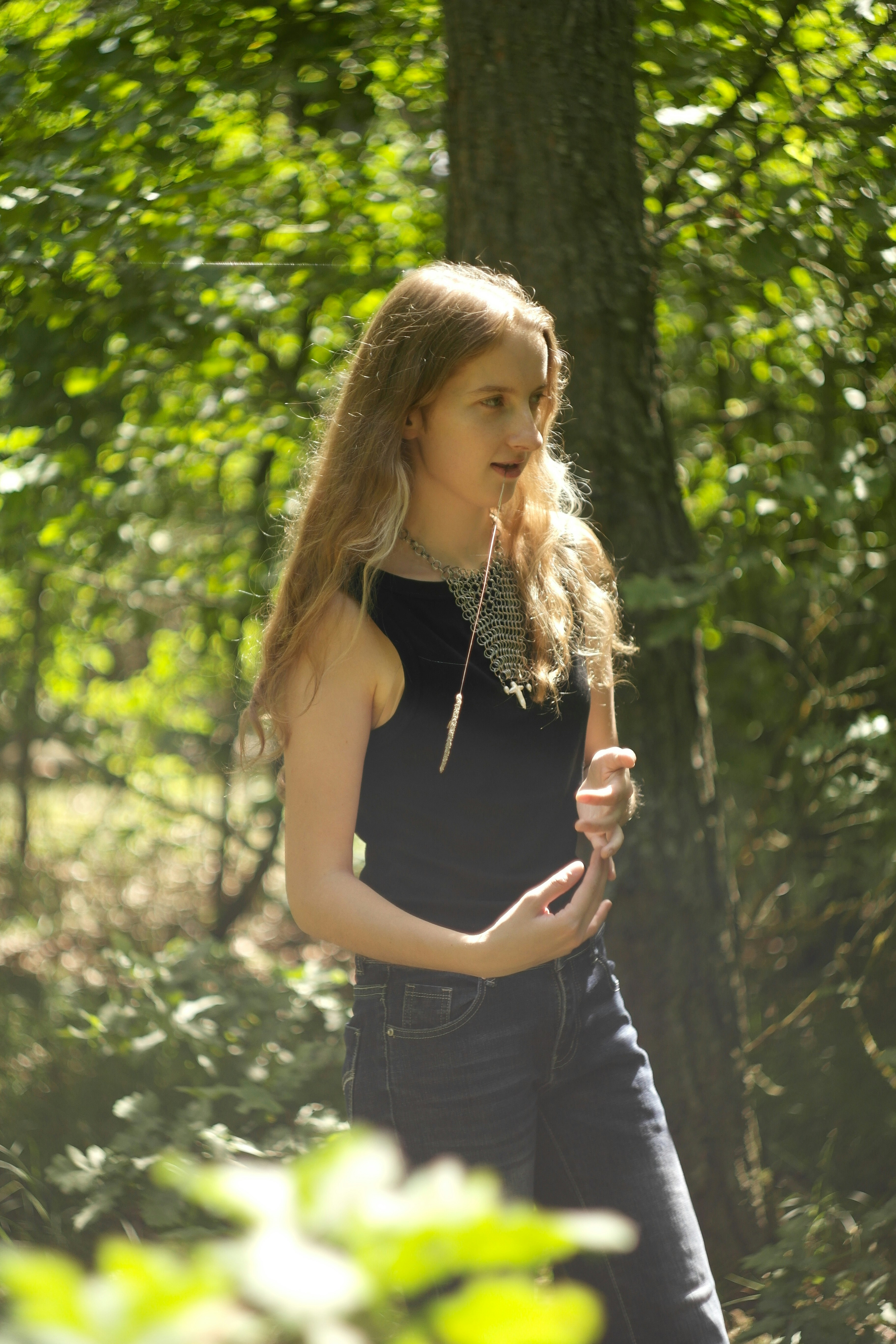 Sunlit Portrait in a Forest Clearing