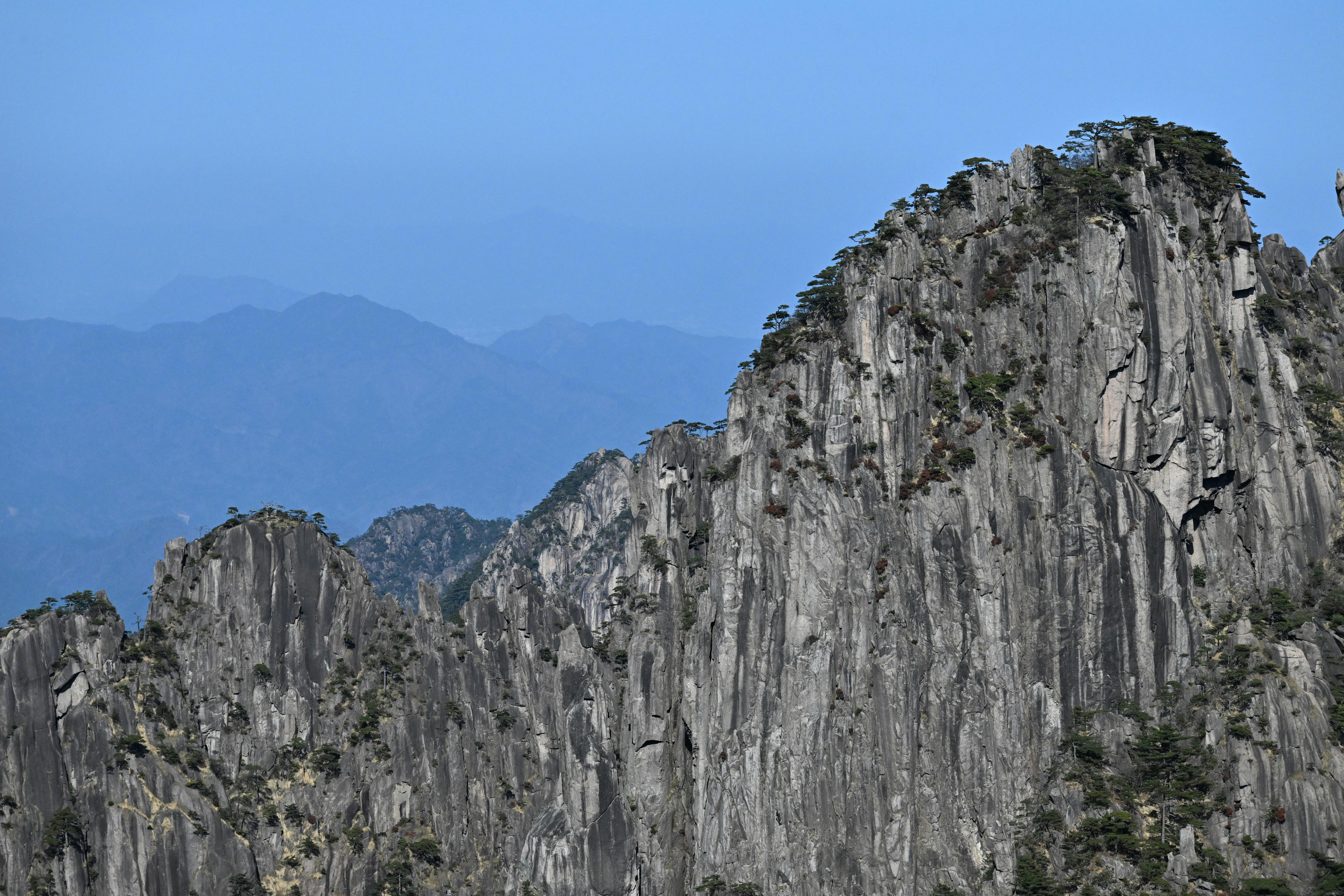 Craggy Summit: A Ridge of Granite with Distant Blue Ranges
