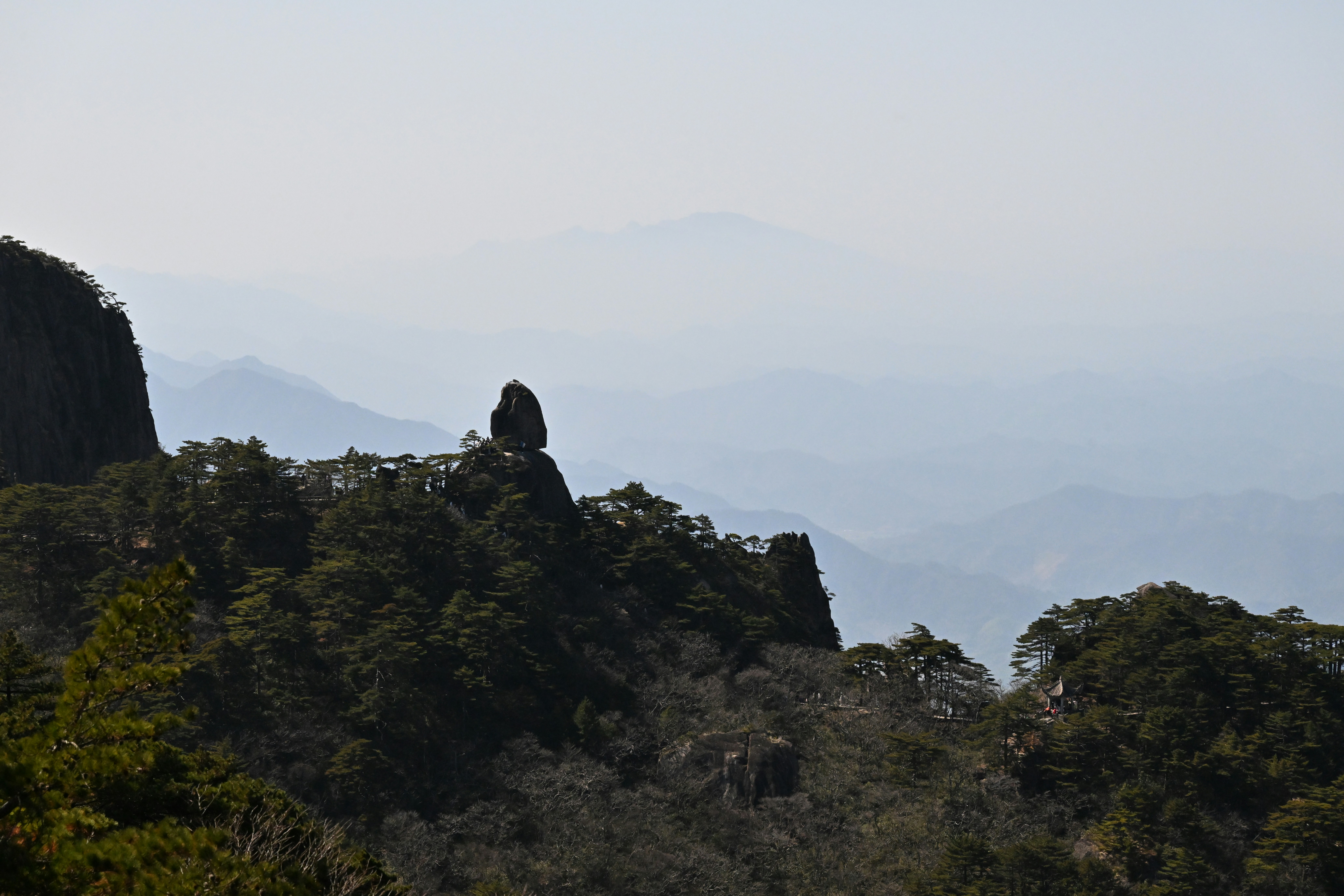 The Sentinel Rock: Mountain Peak Amid Misty Horizons