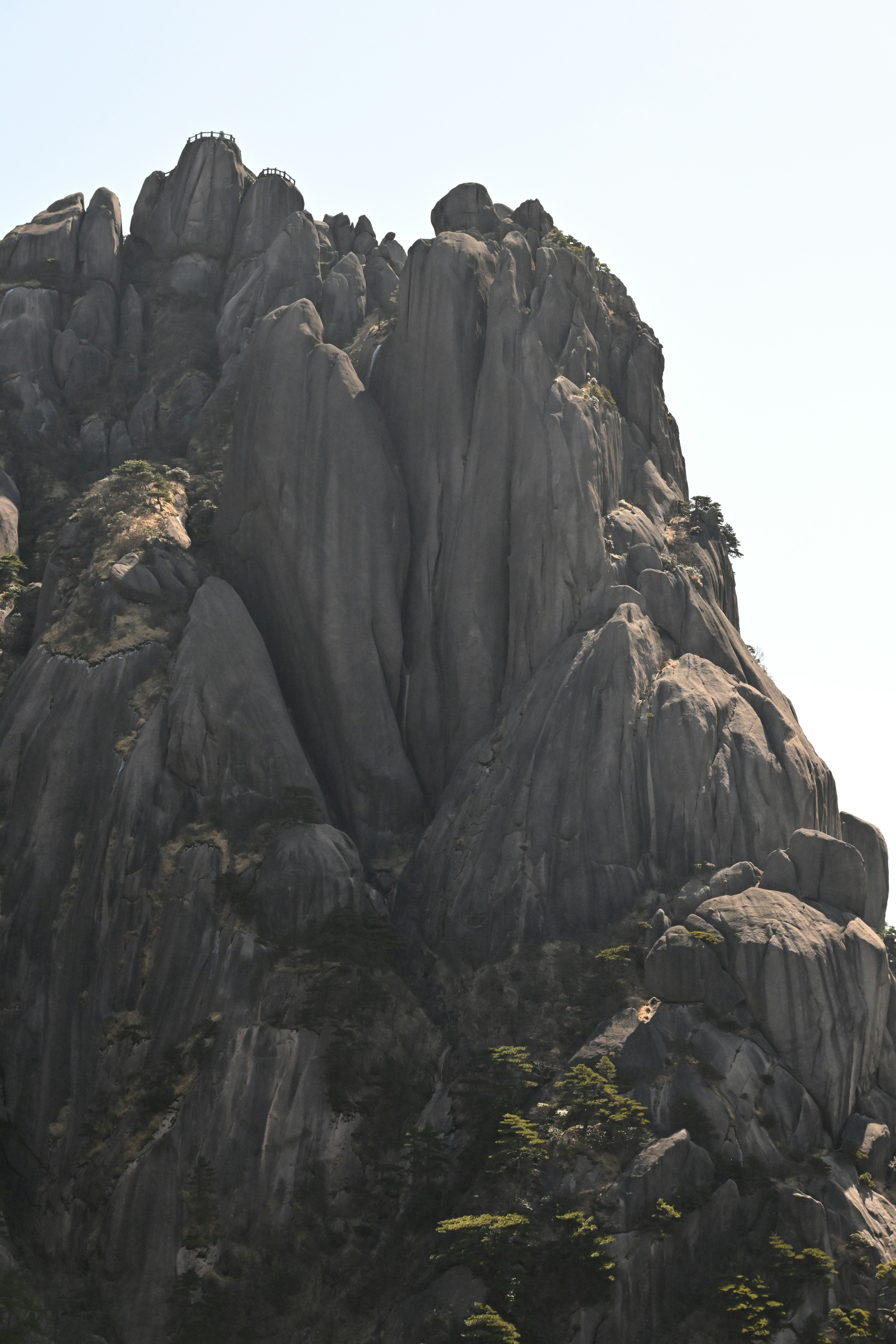 Monolithic Peaks: Gray Carved Giants Rising