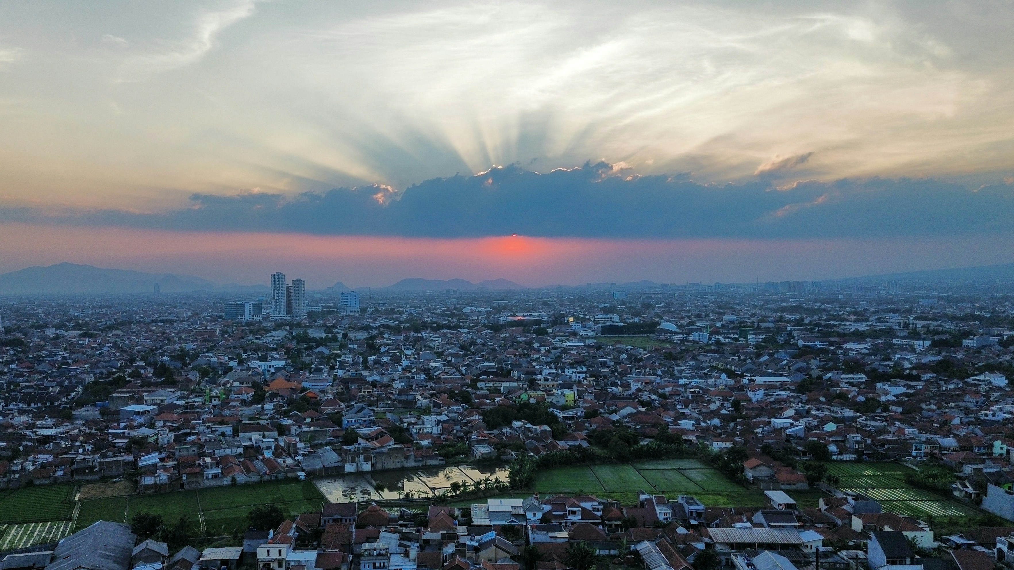 Sunset Break over a Patchwork City