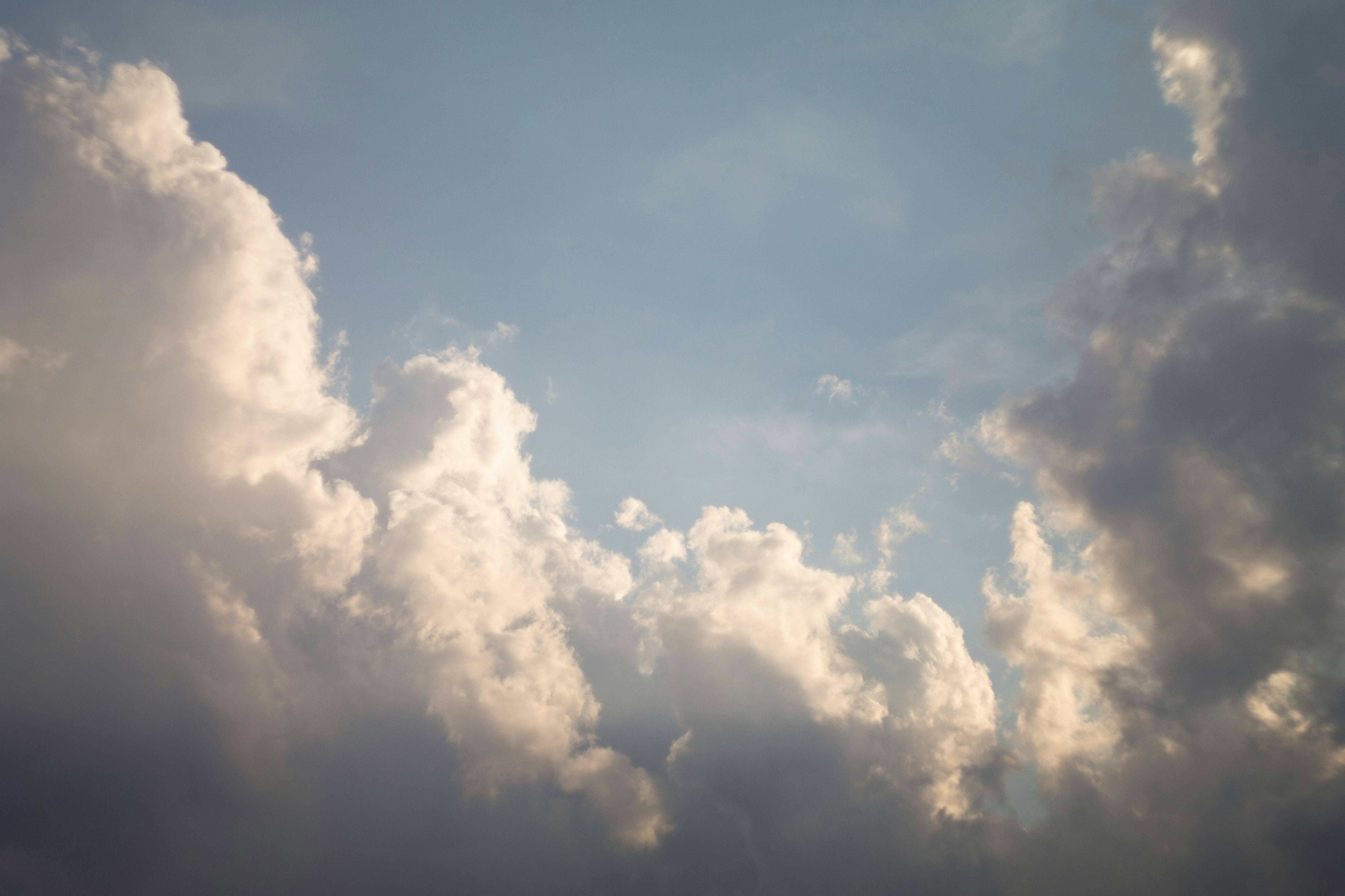 Sunlit Cloudscape: A Quiet Break in the Sky