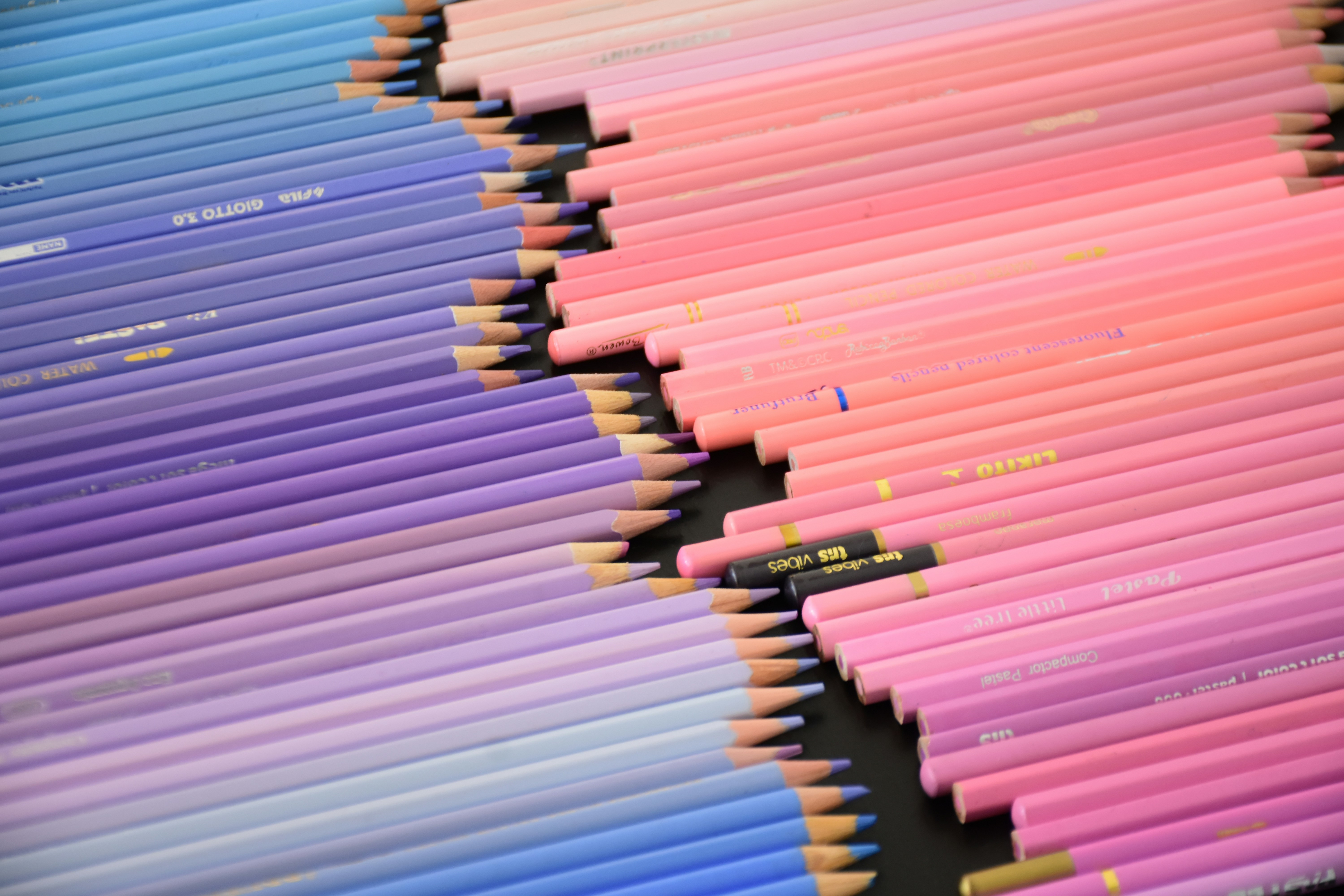 Cascade of Colored Pencils: A Ribbon of Pastels Reverberating Across the Frame