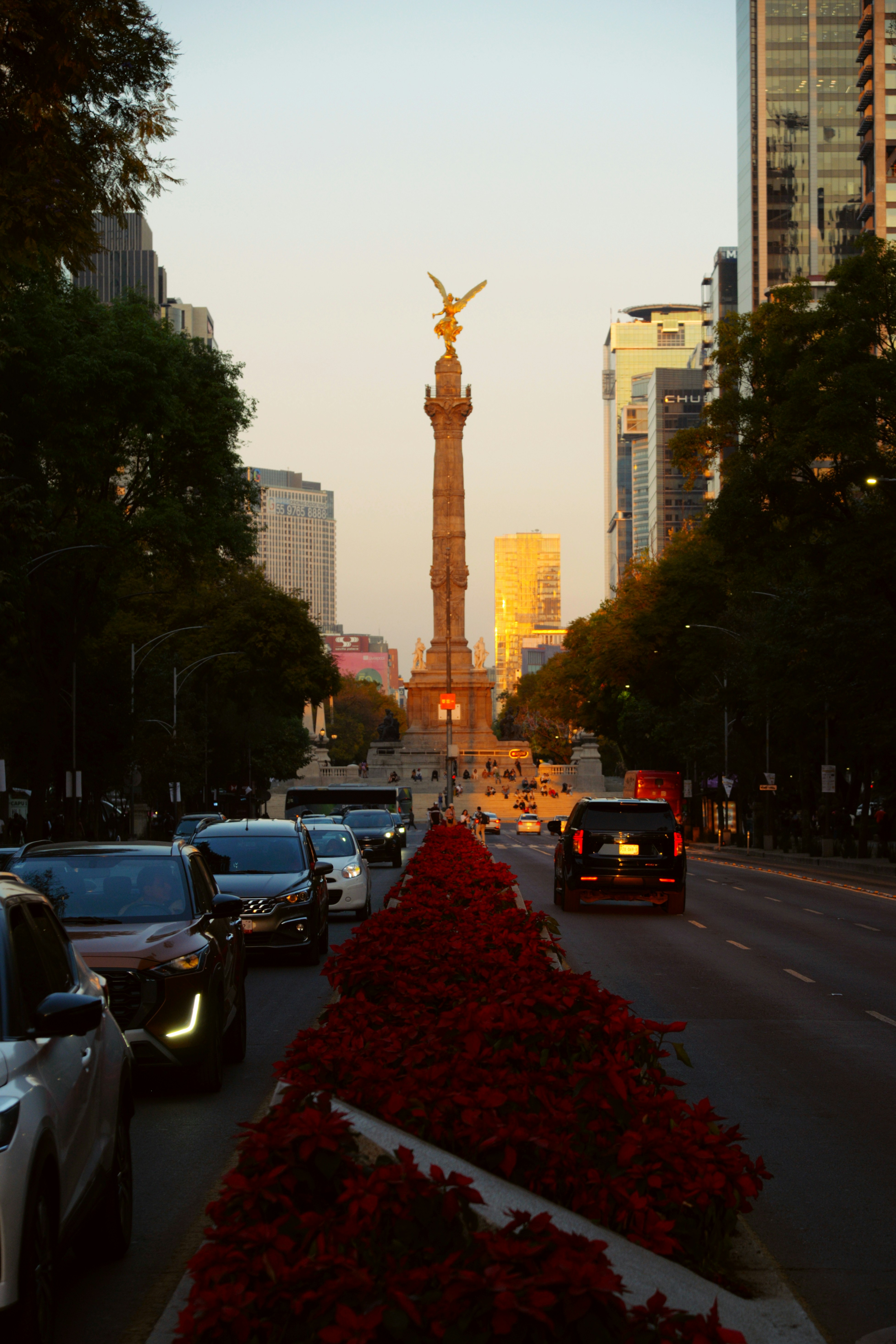Sunlit Triumph: The Victory Column Framed by Midtown Skyline