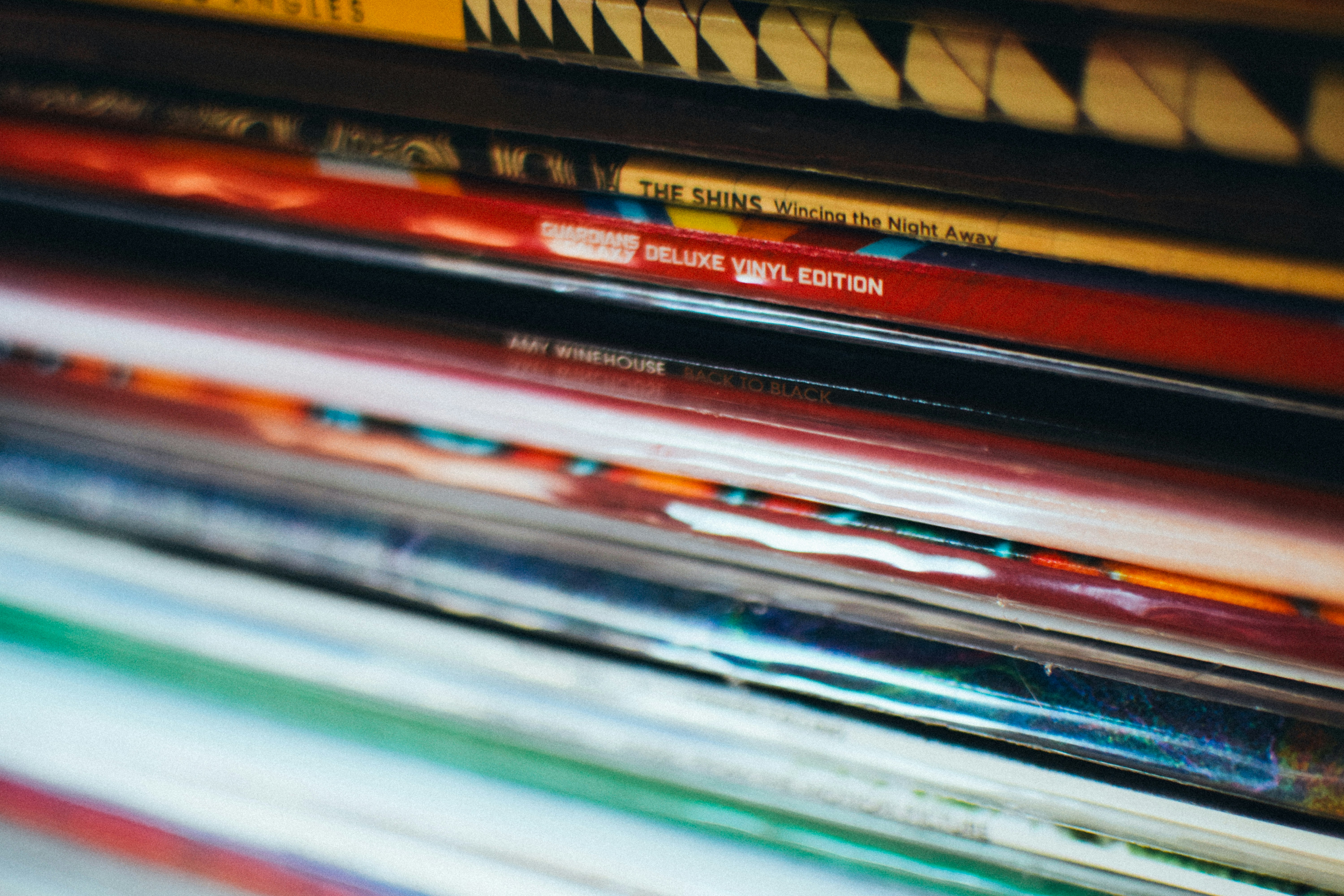 Vinyl Stacks: A Close-Up of Colorful Record Spines