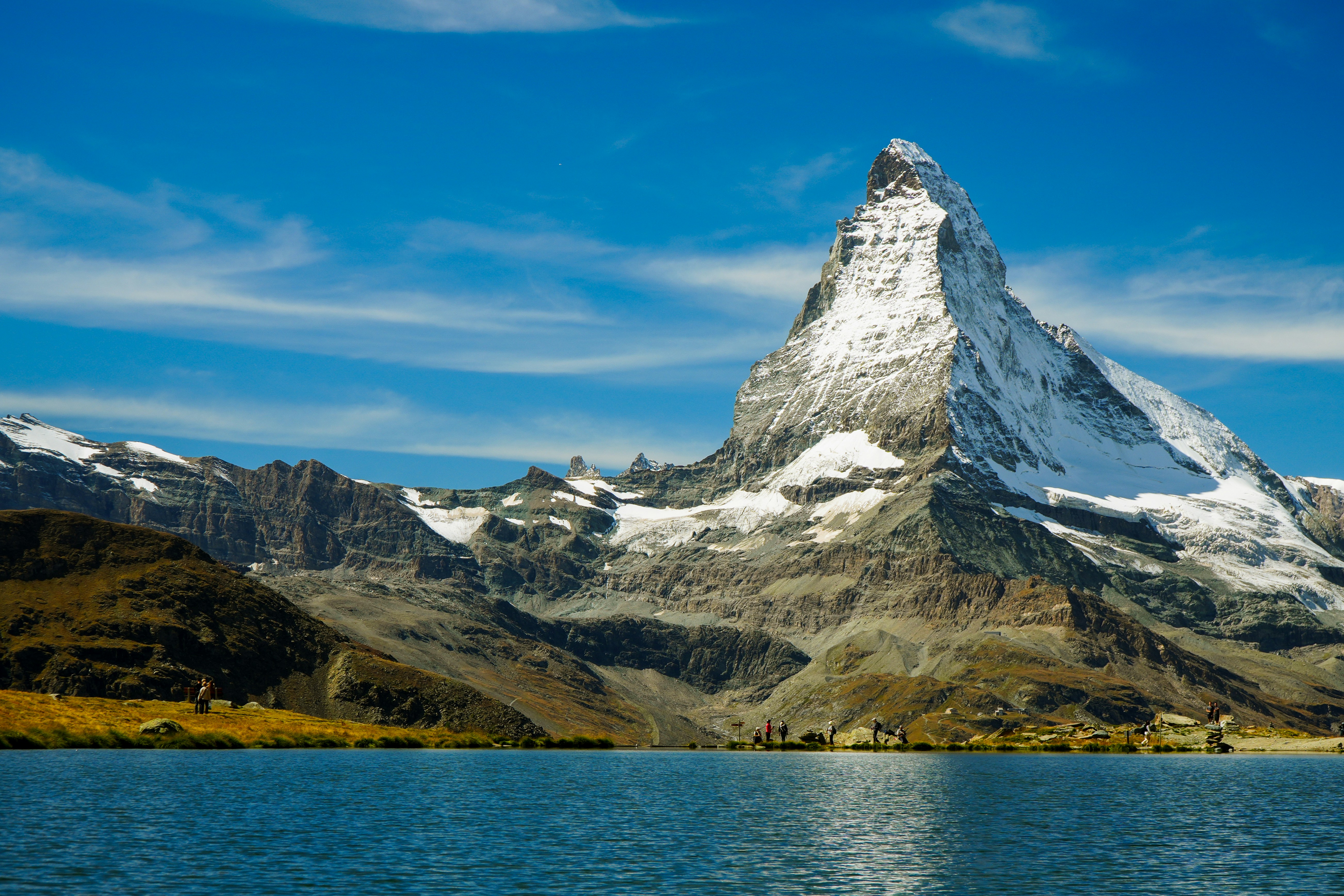 Snow-capped Peak Reaching Over a Quiet Alpine Lake