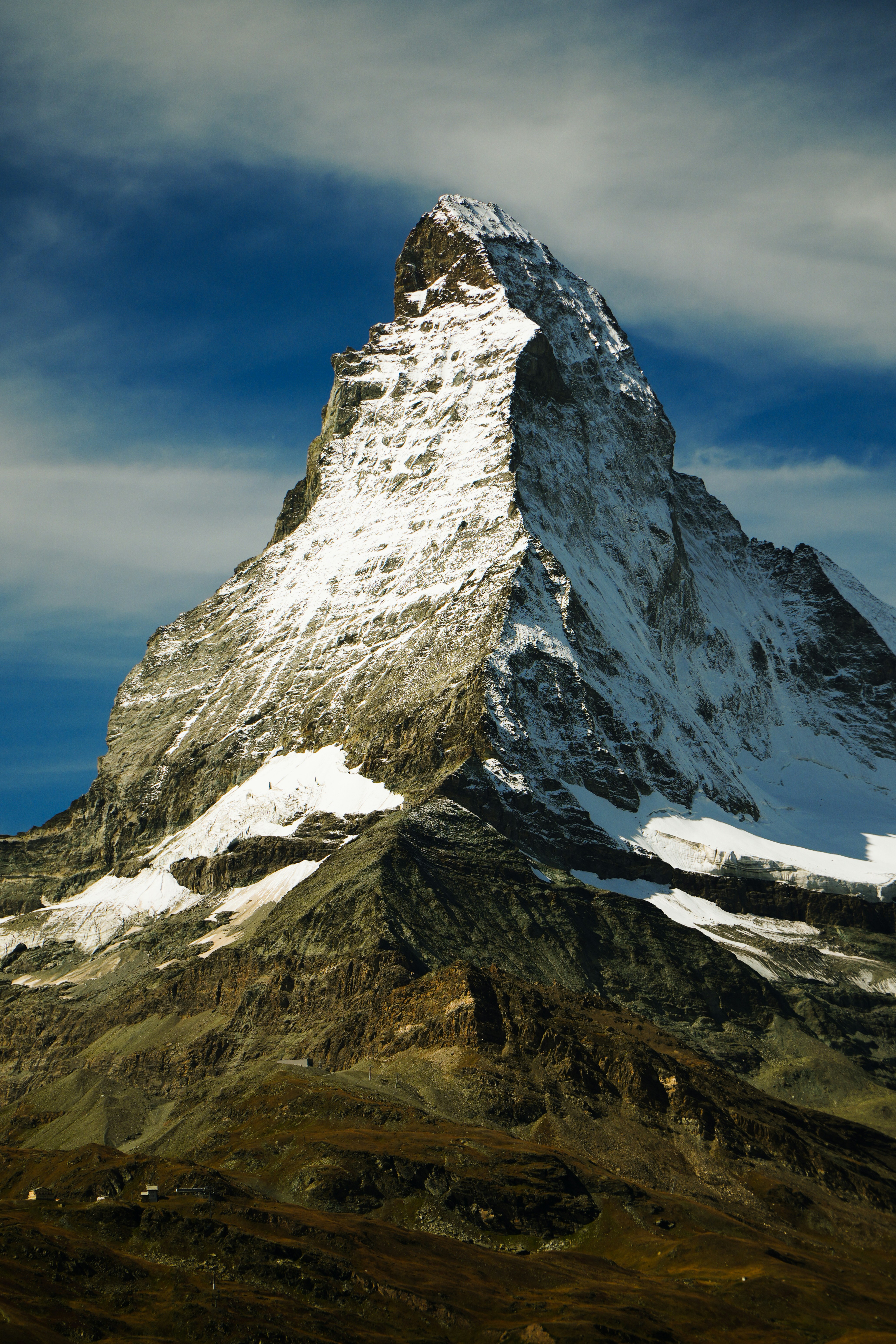 Crag of the Crown: Snowcapped Peak Rising into a Canyon-Wide Azure