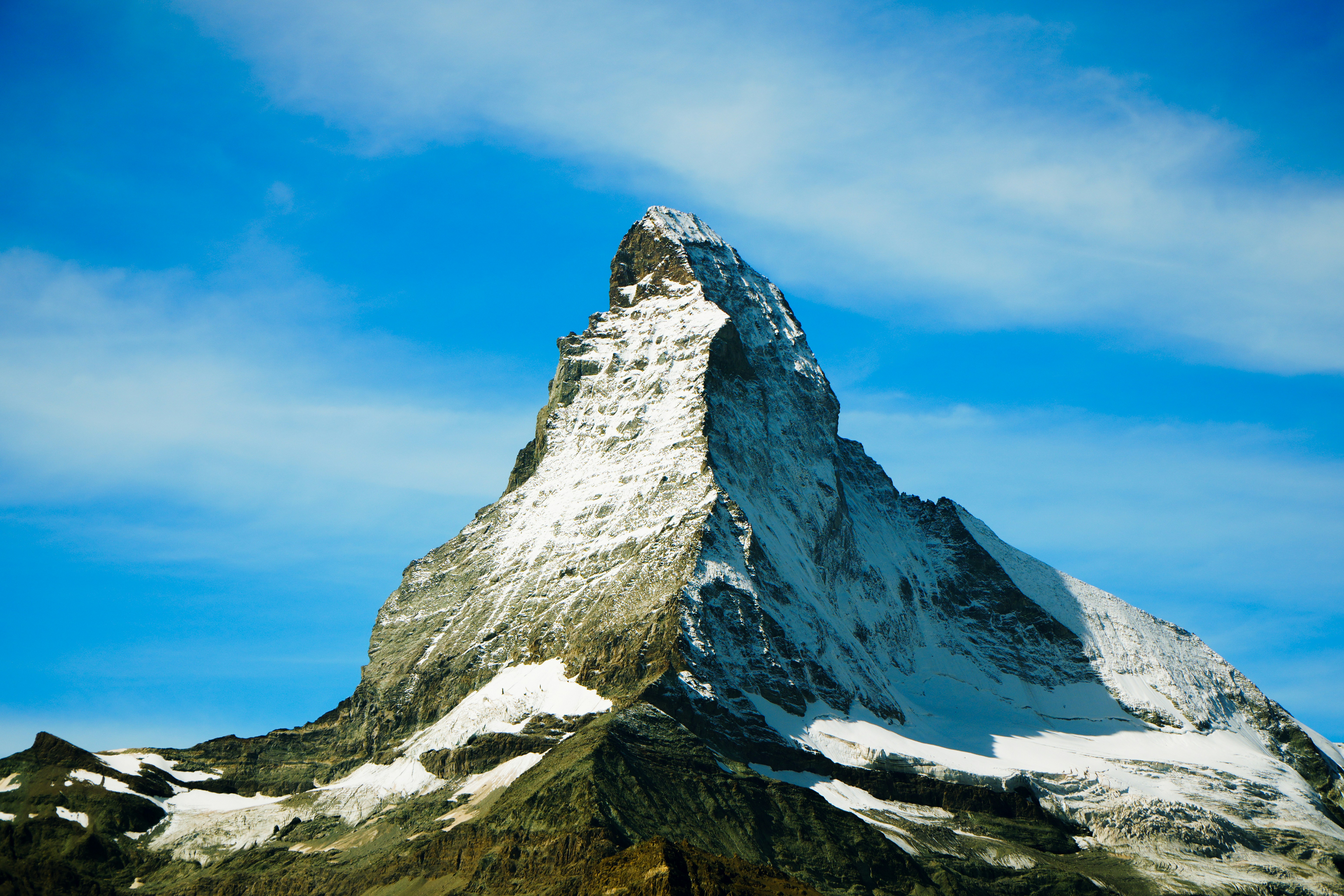 The Snow-Crowned Pinnacle Reaching Toward a Clear Sky