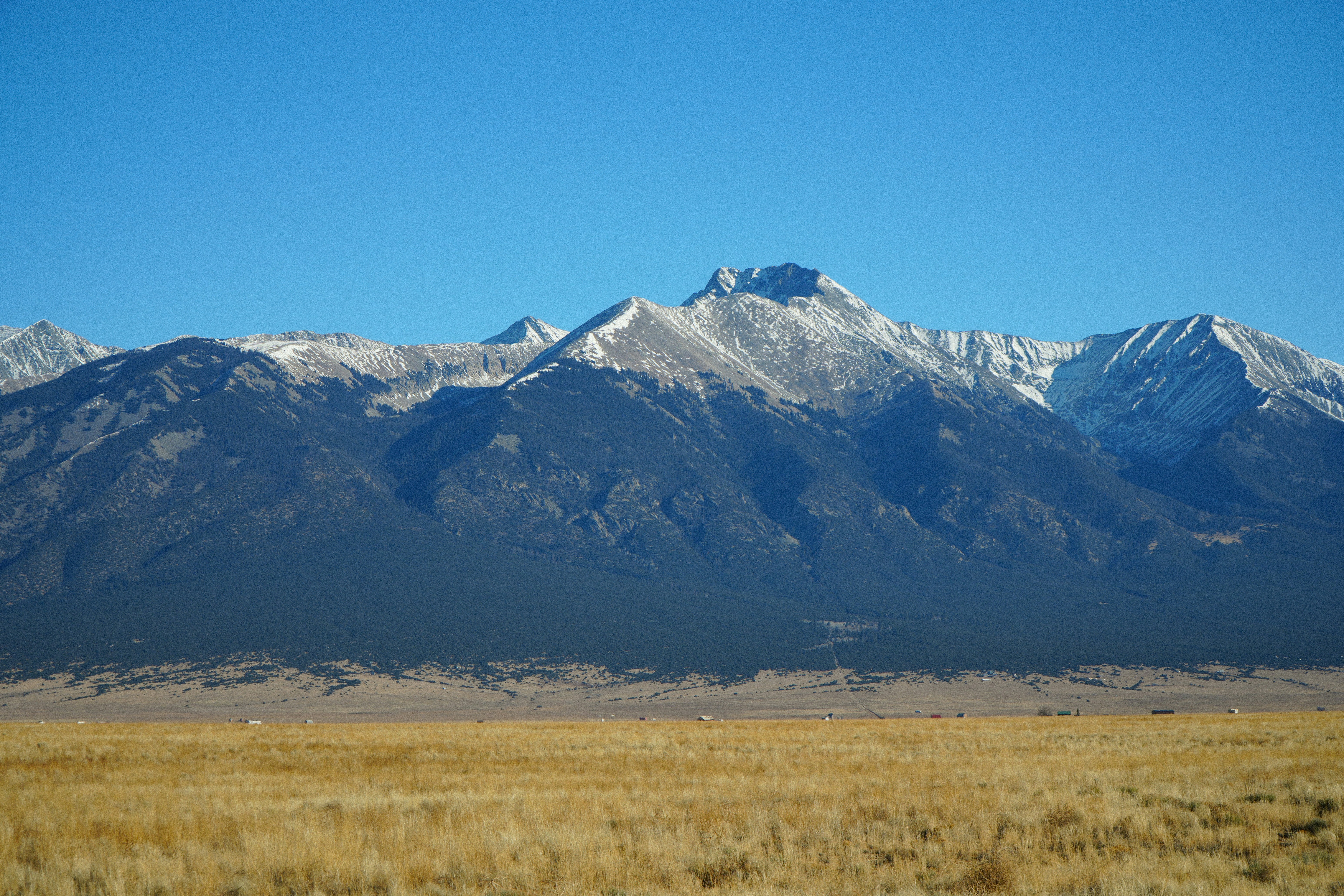 Snow-Capped Ridge Beneath a Clear Blue Sky