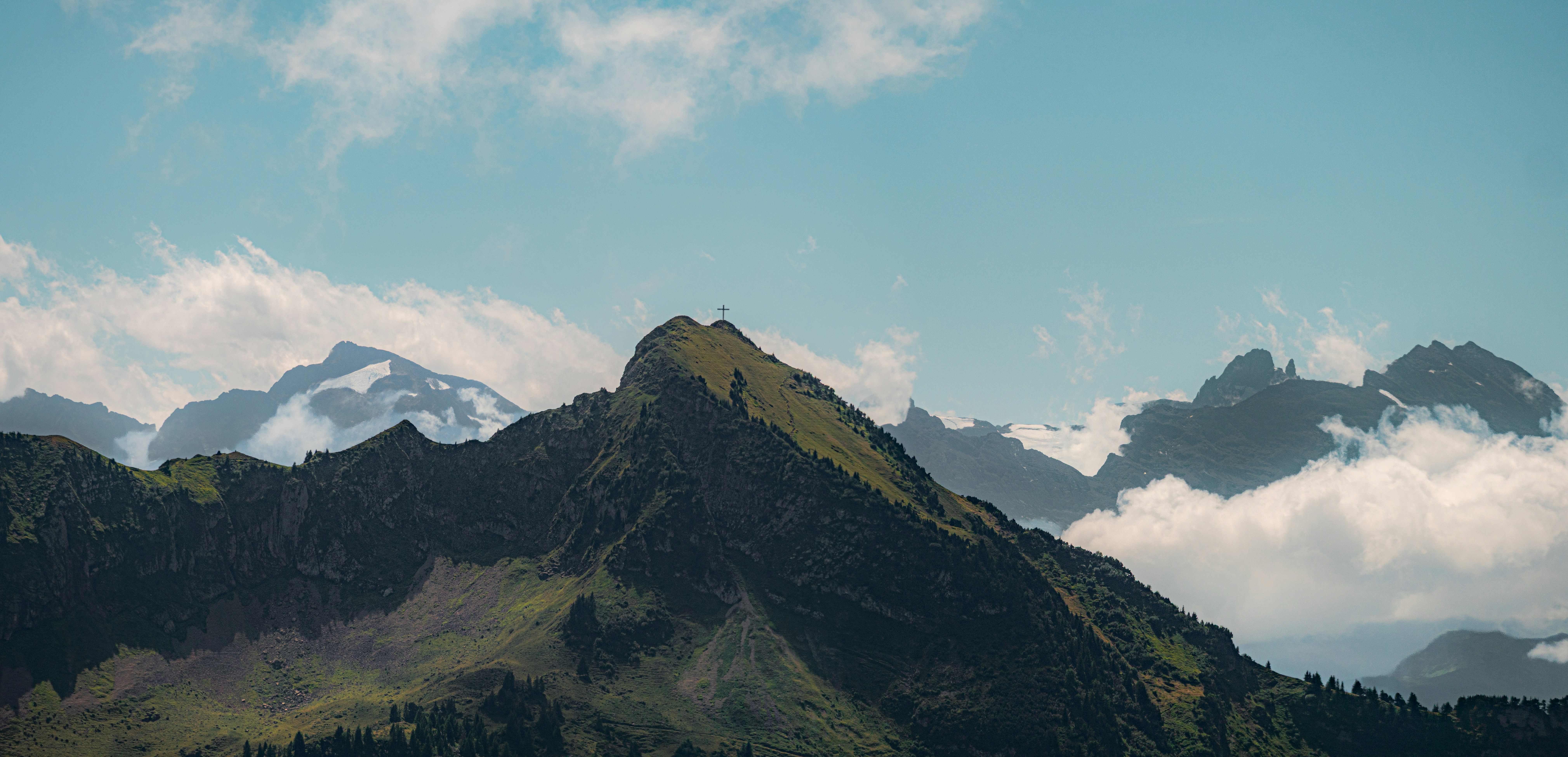 Peak Crest Above the Clouds: A Quiet Ridge Under Open Skies