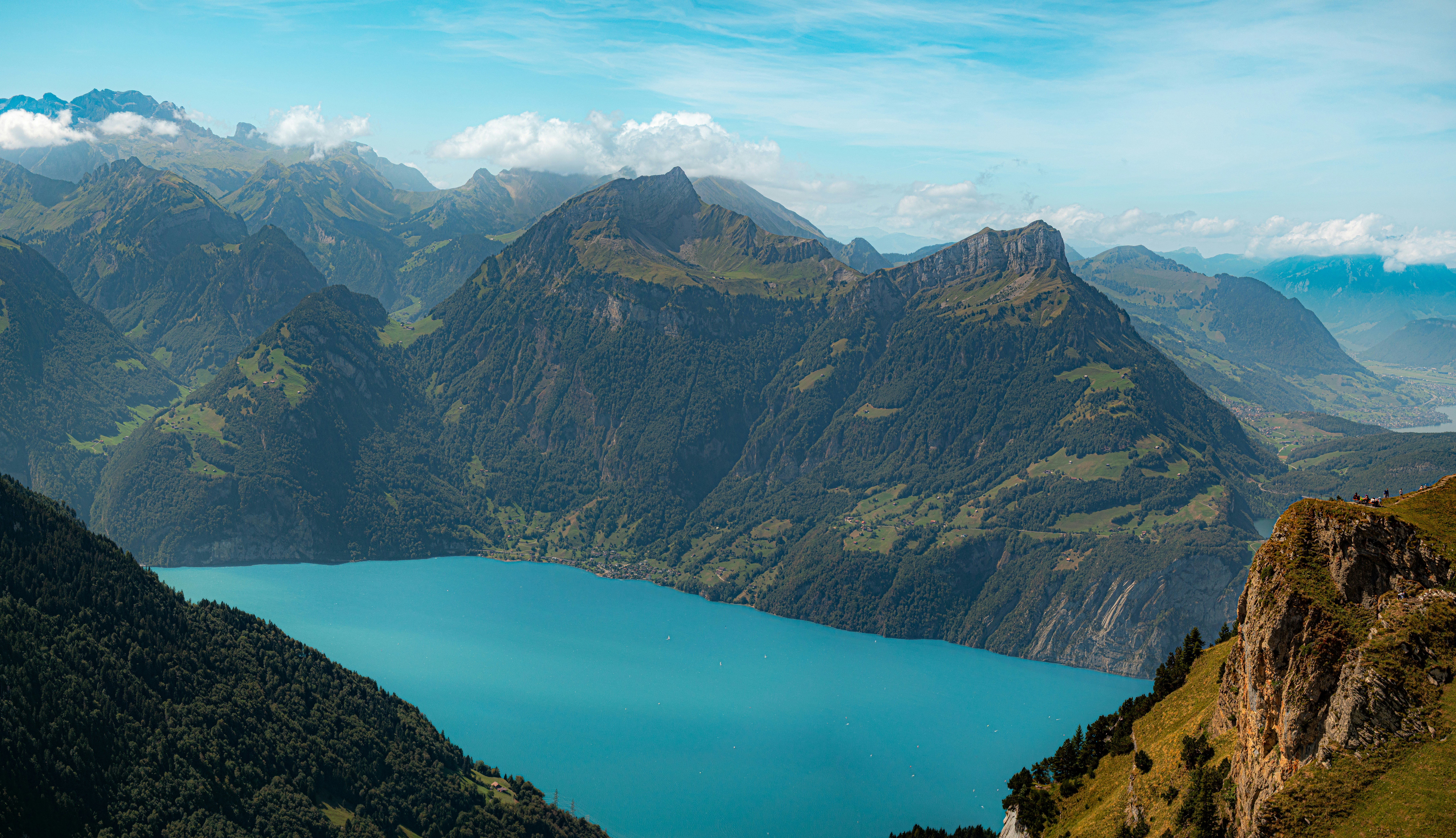 Emerald Rim: A Serene Lake Nestled Between Mountain Giants