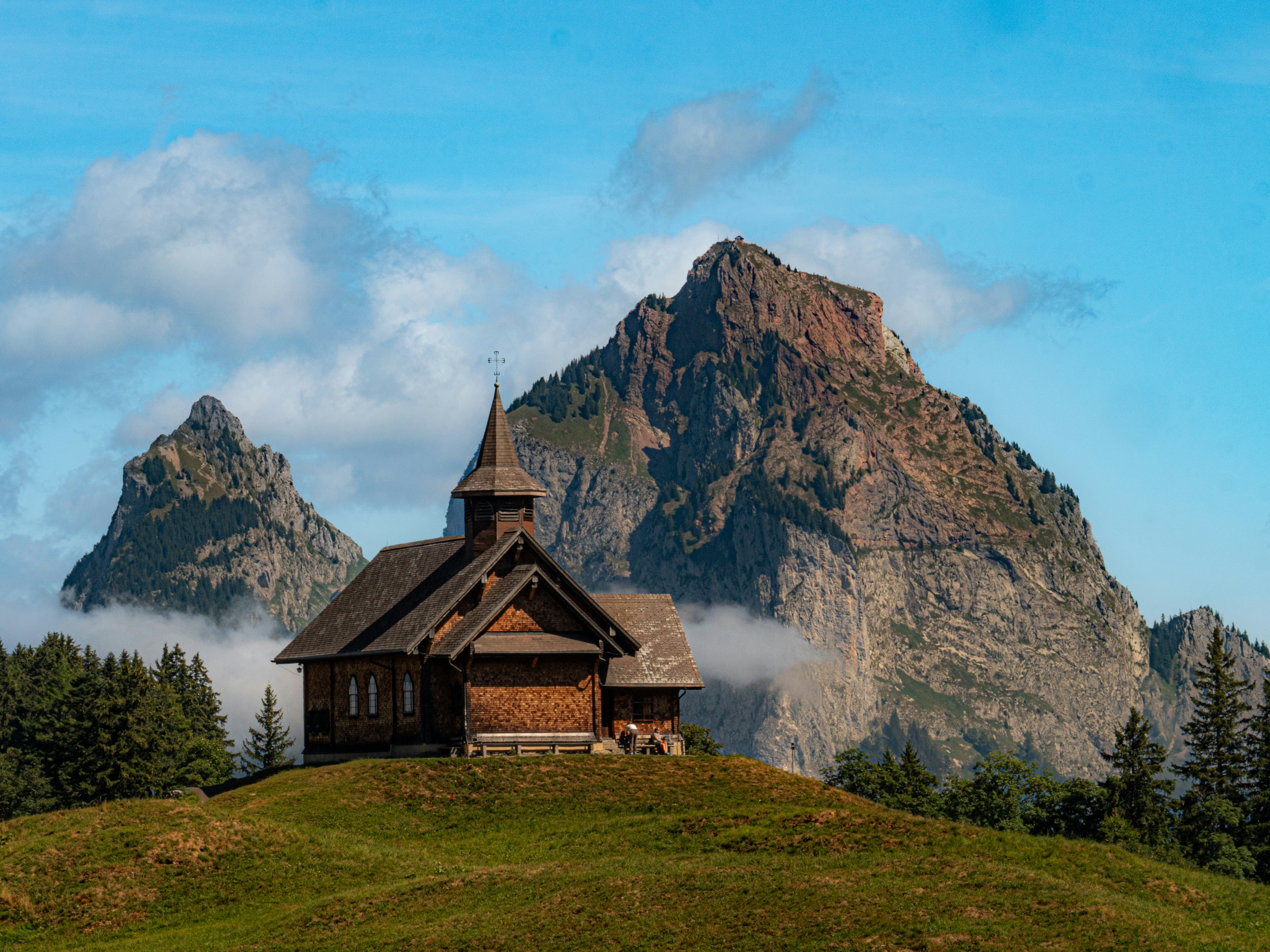 Mountain Chapel in a Misty Valley