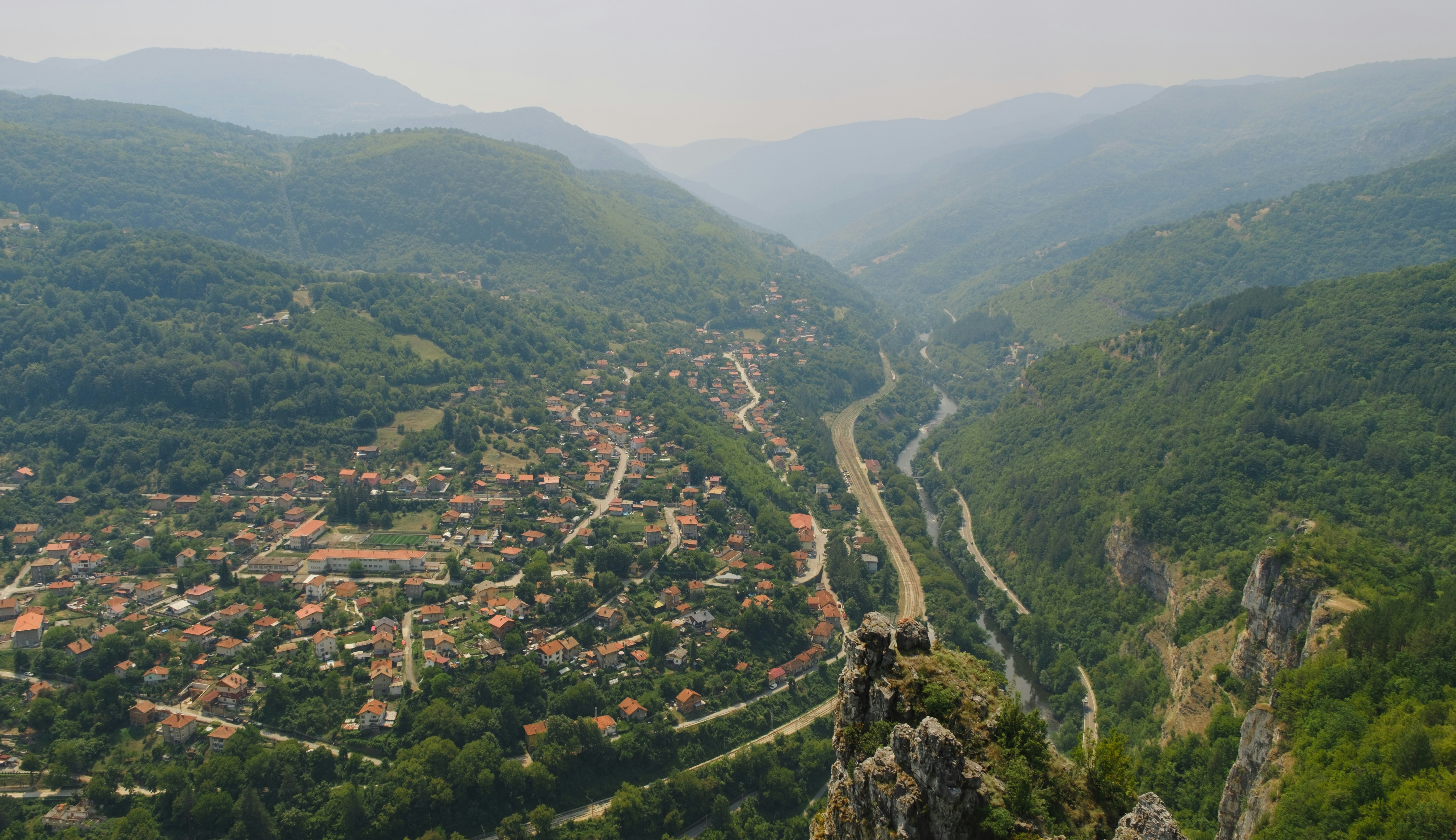 Aerial Vista into a Winding Valley Town