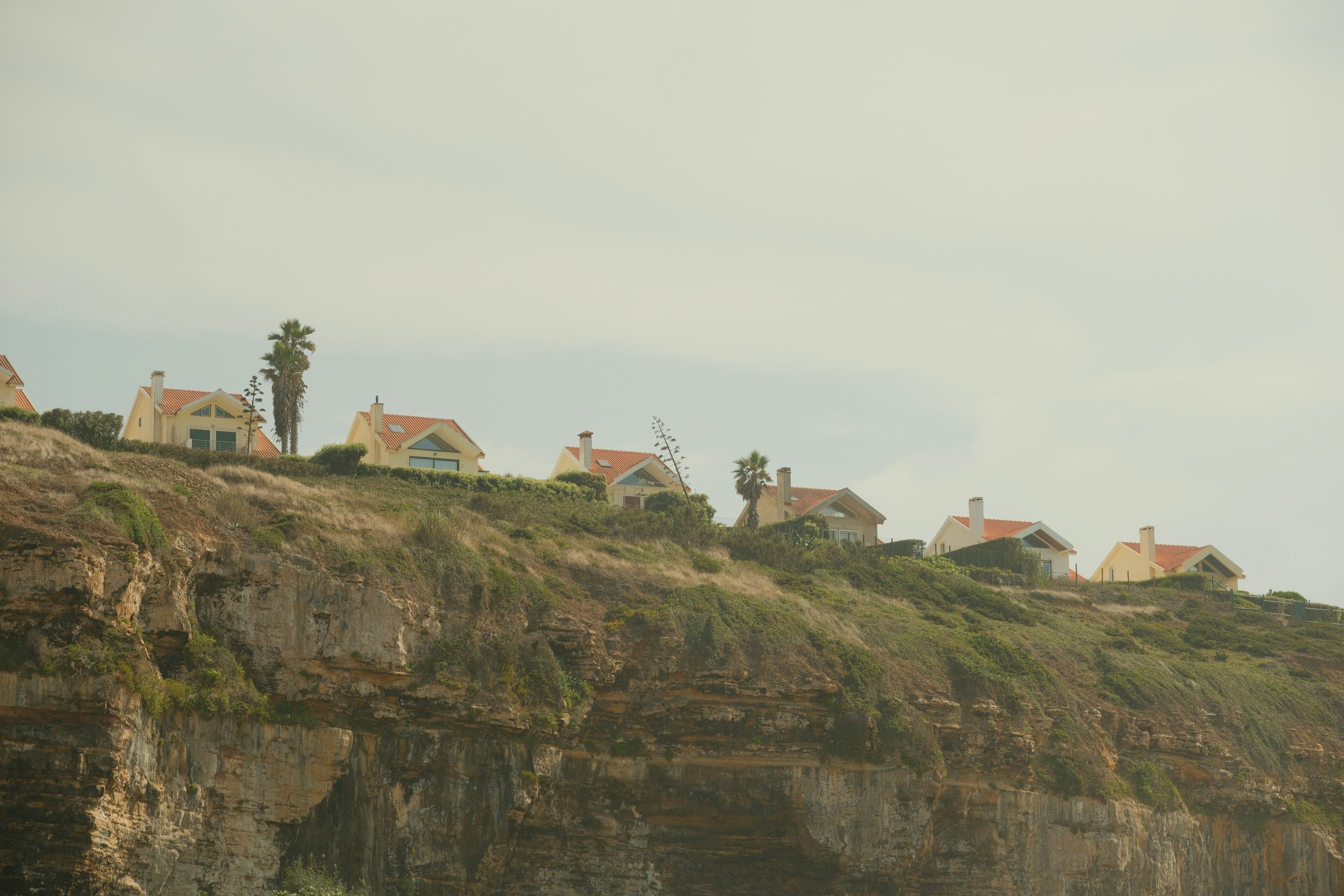 Coastal Village Silhouette Along the Cliffline