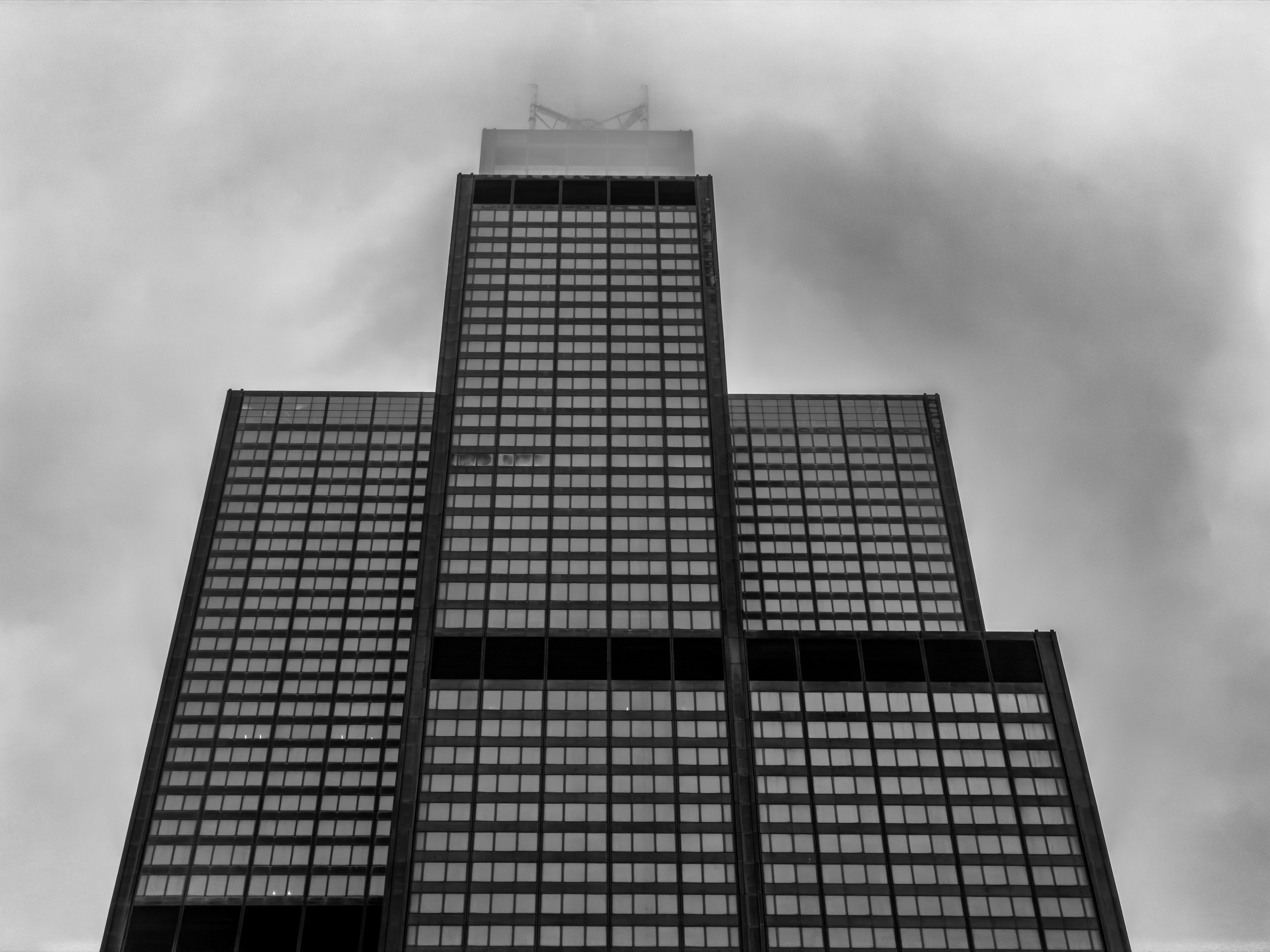 Monolithic Prism: A Skyscraper Constellation Rising from a Misty Grid