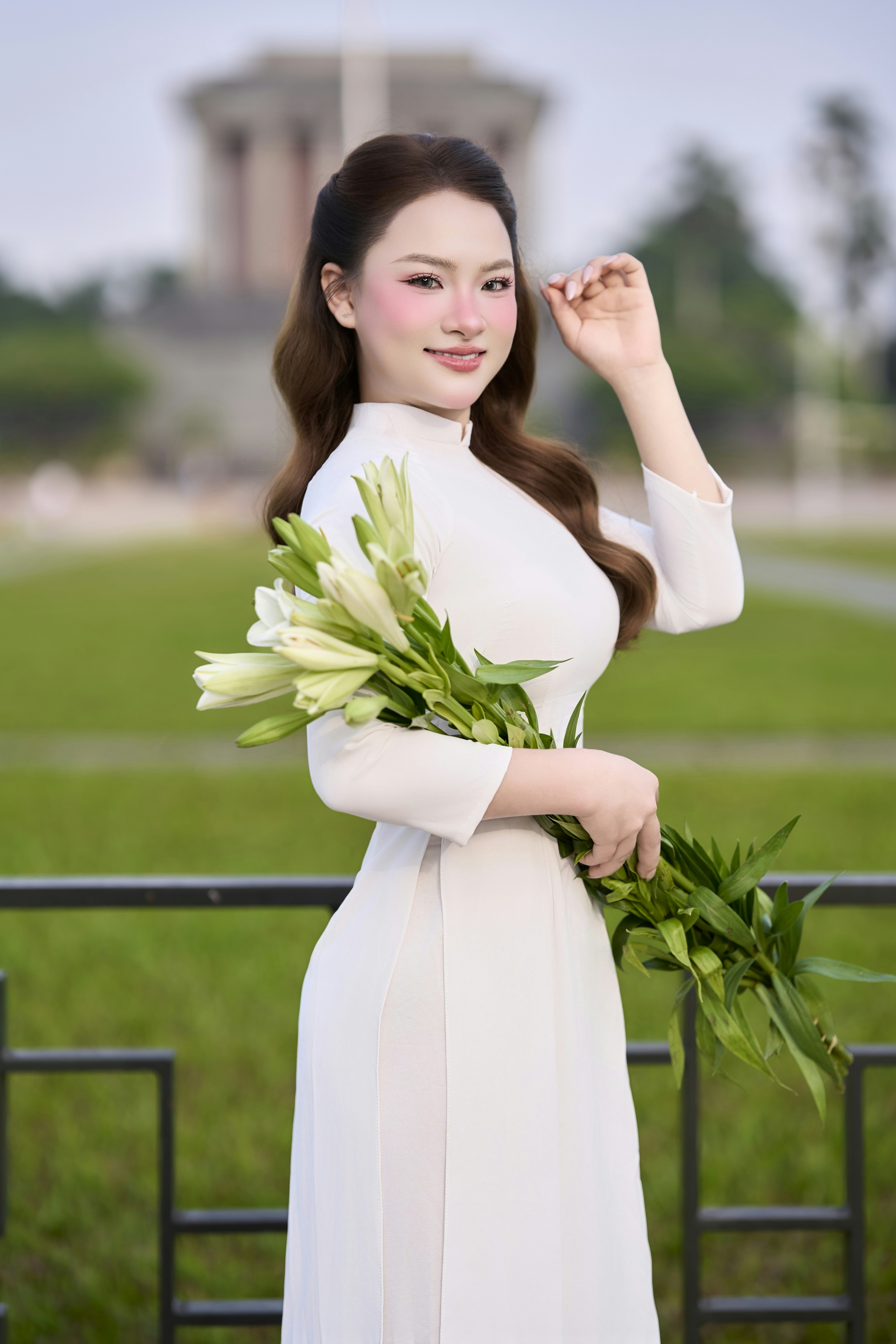 Portrait in White: A Poised Moment with Lily Bouquet