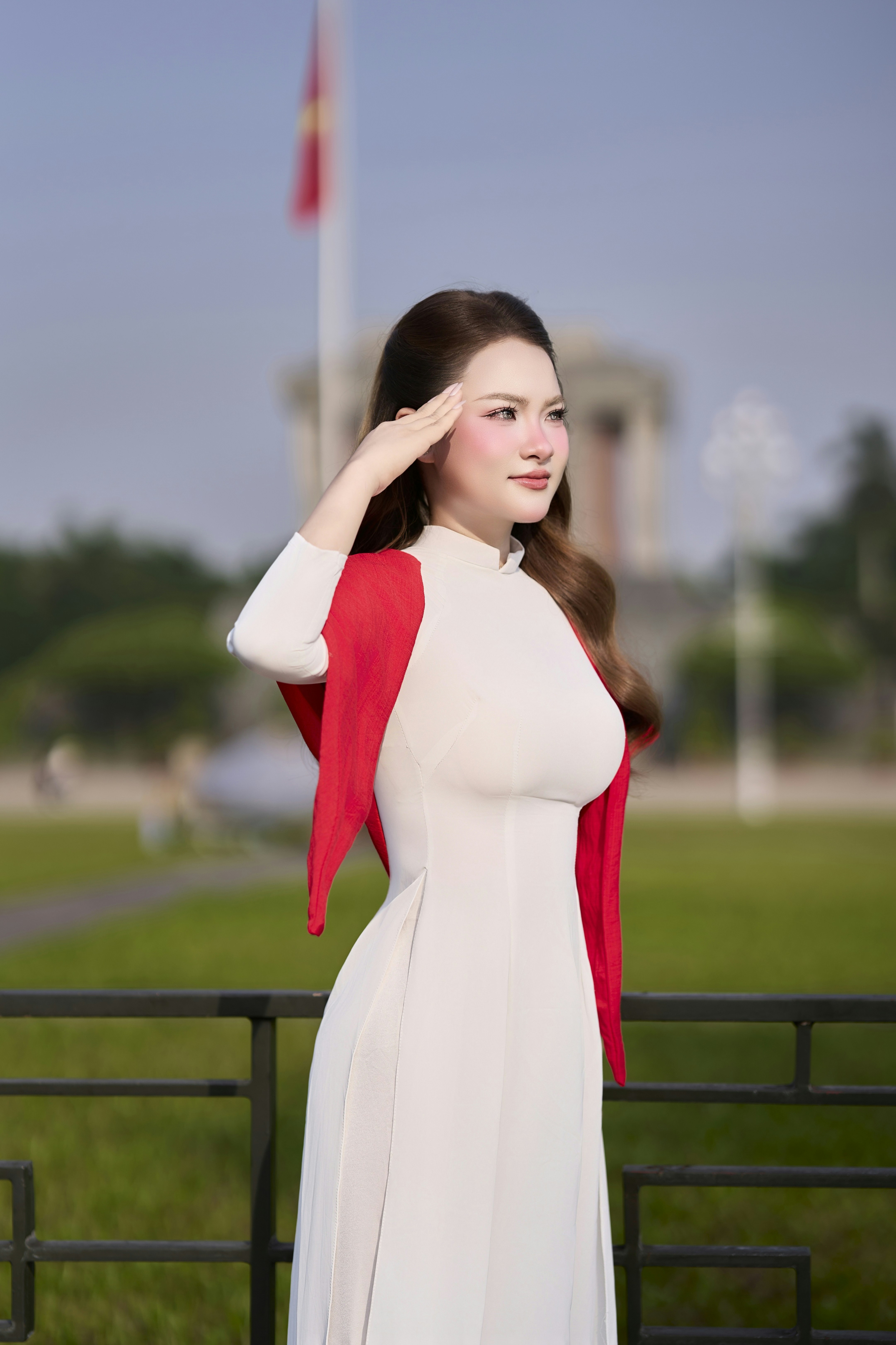 Portrait in White: Graceful Salute on a Sunlit Campus
