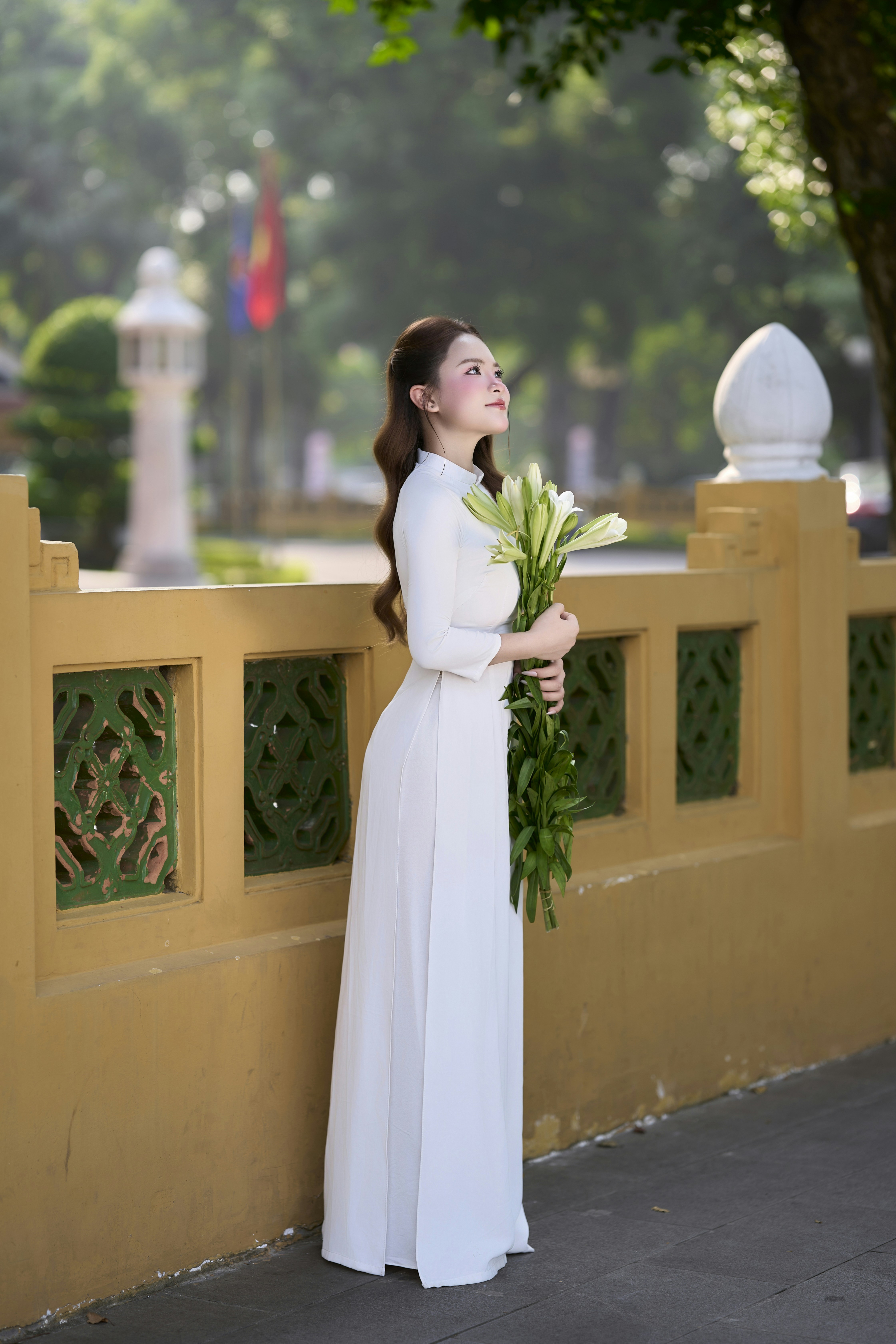 White-robbed bouquet: Grace among the sunlit railing
