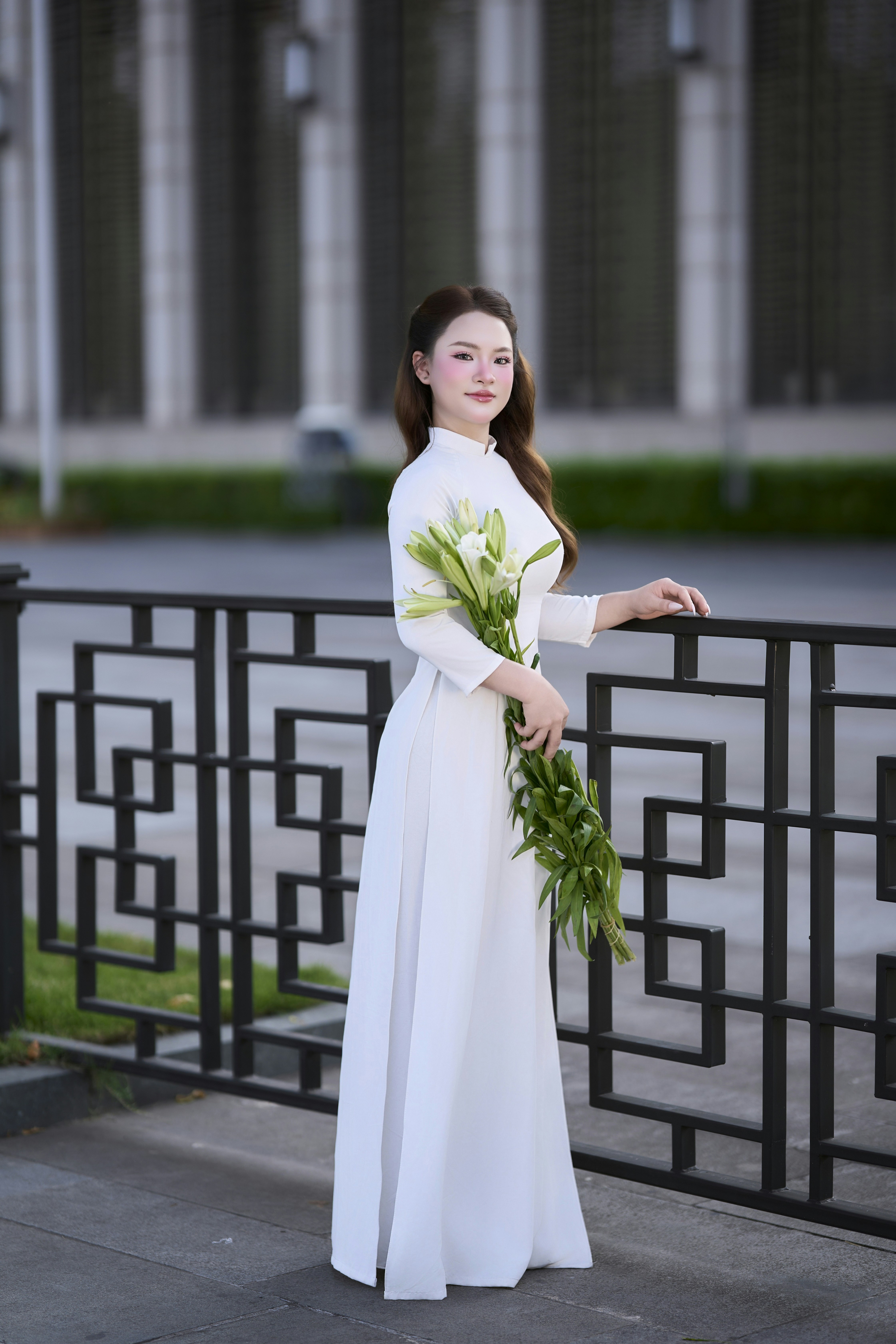 Elegance by the Rail: A Portrait in White