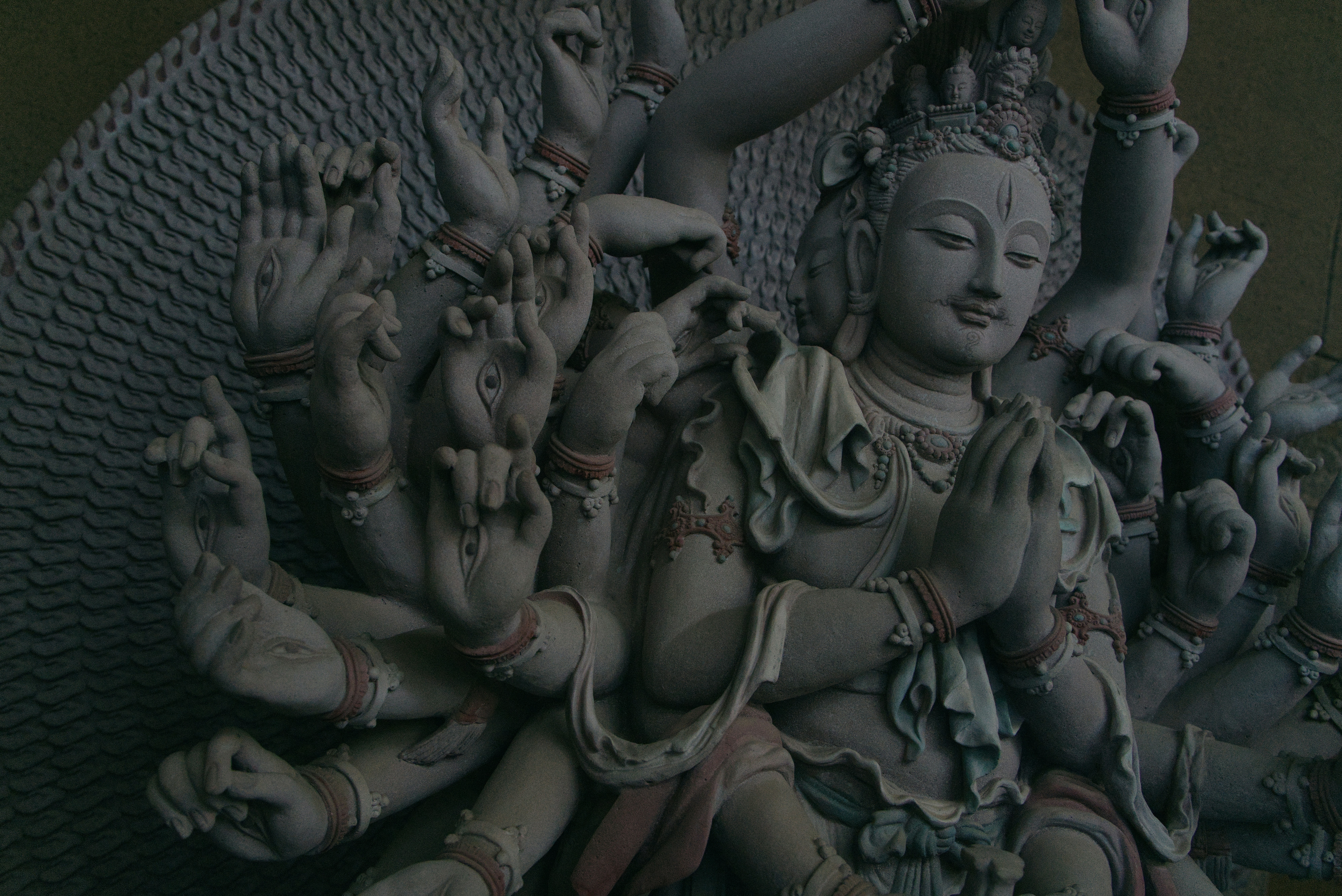 Guardians of the Multitudinous Deities: A Quiet Carved Statuary in Dim Light